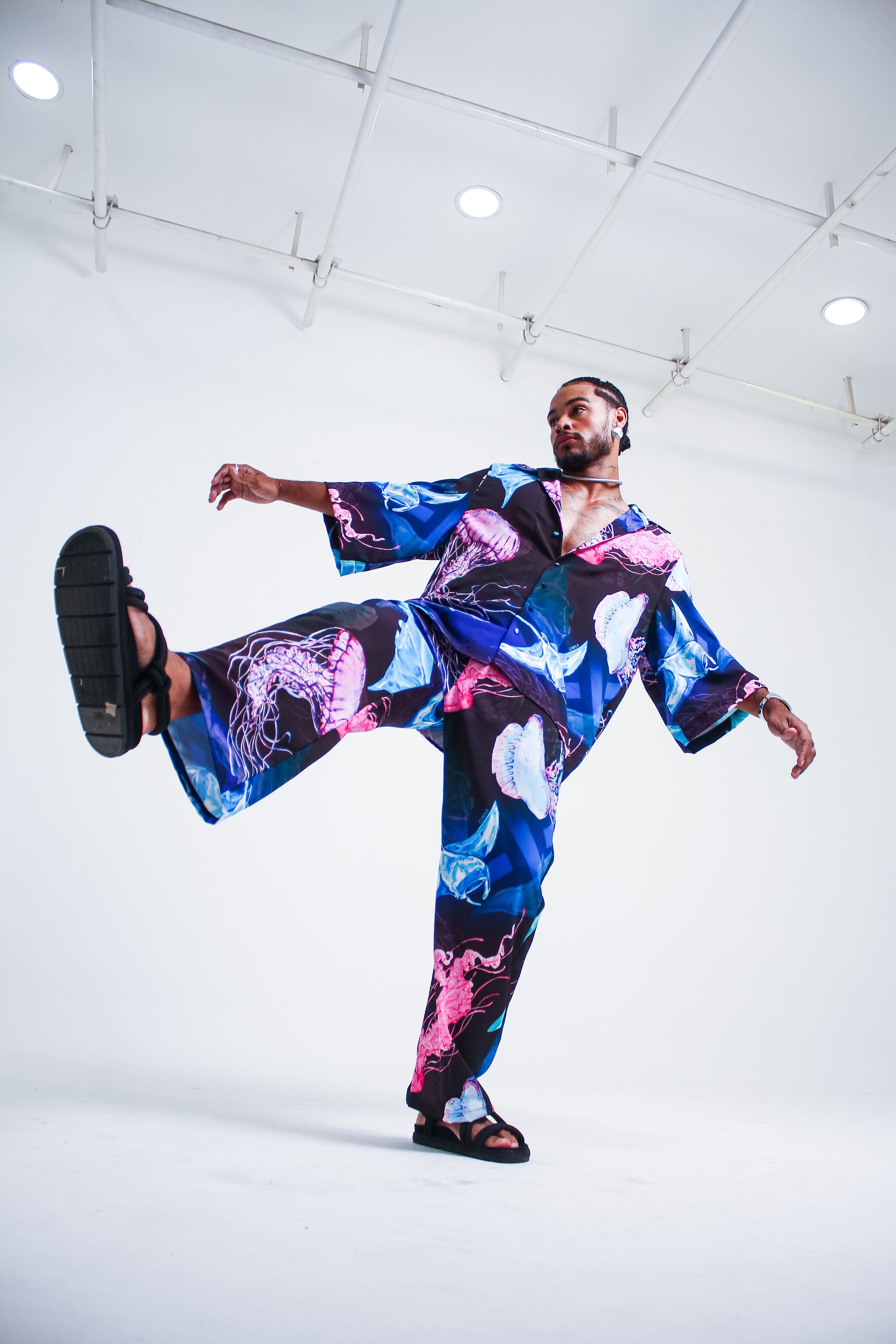 Man in Artistic Jellyfish Printed Outfit Striking Pose · Free Stock Photo