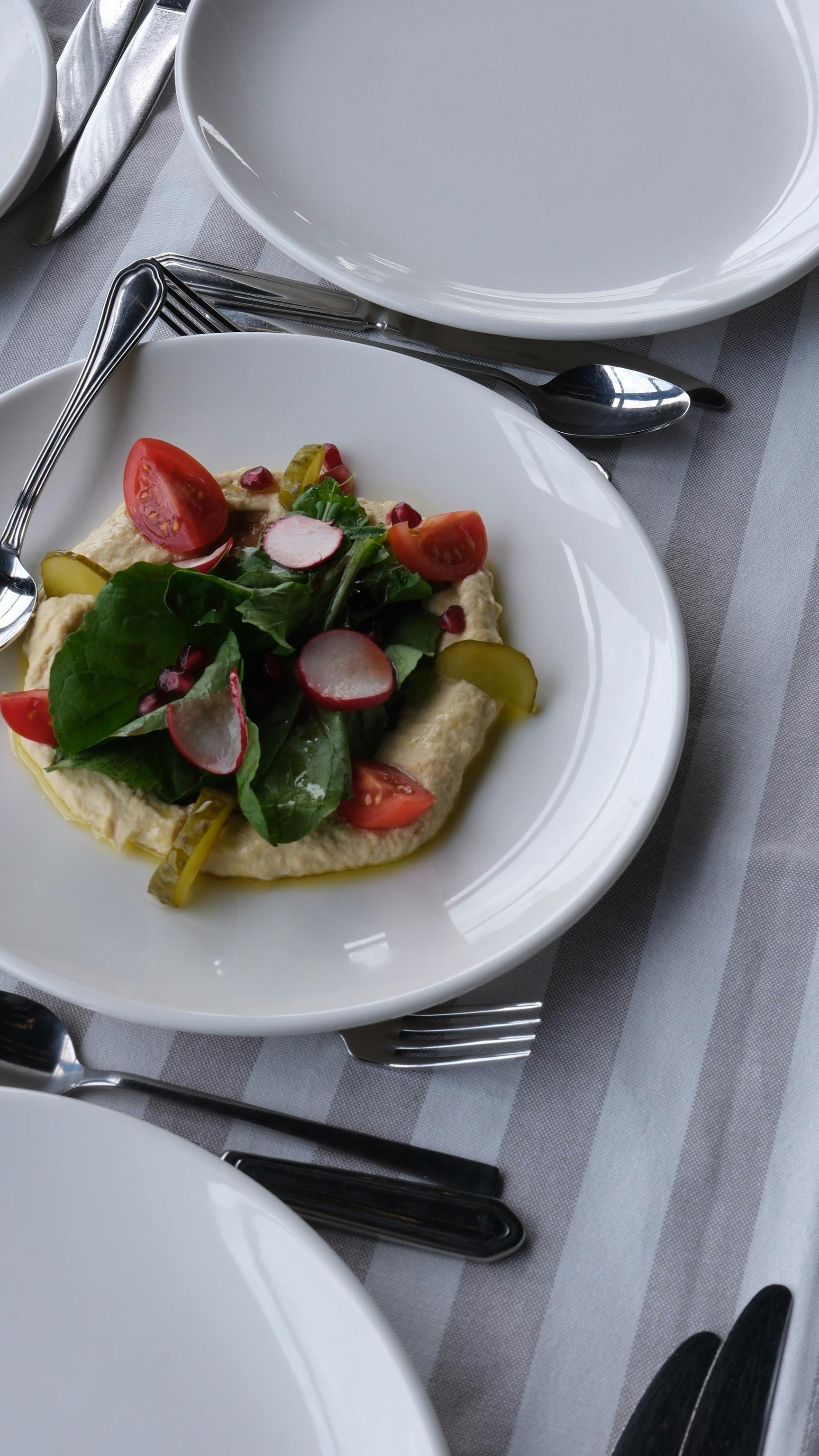 Mediterranean Salad on Elegant Table Setting · Free Stock Photo