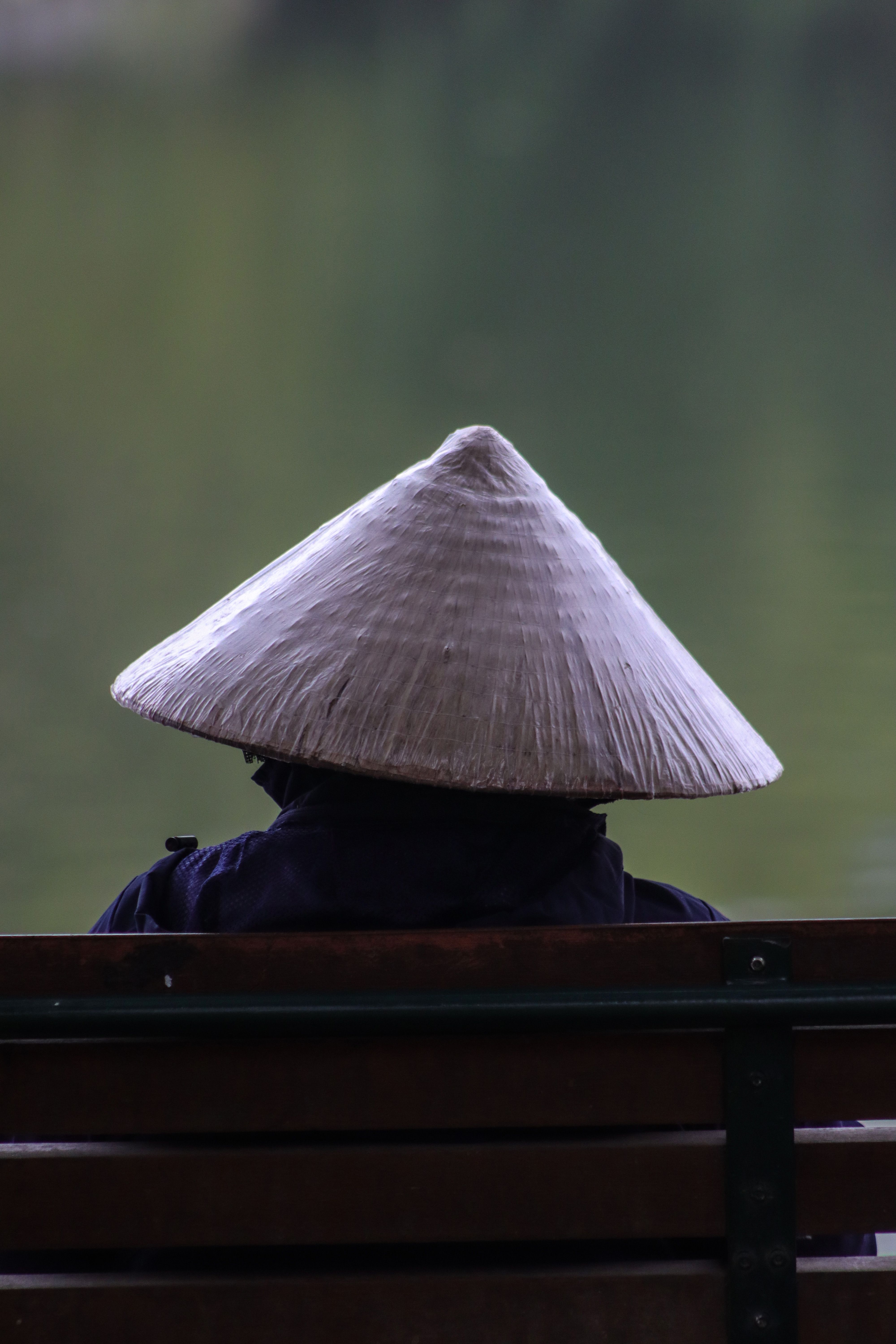 Person Wearing Conical Hat by Calm River · Free Stock Photo