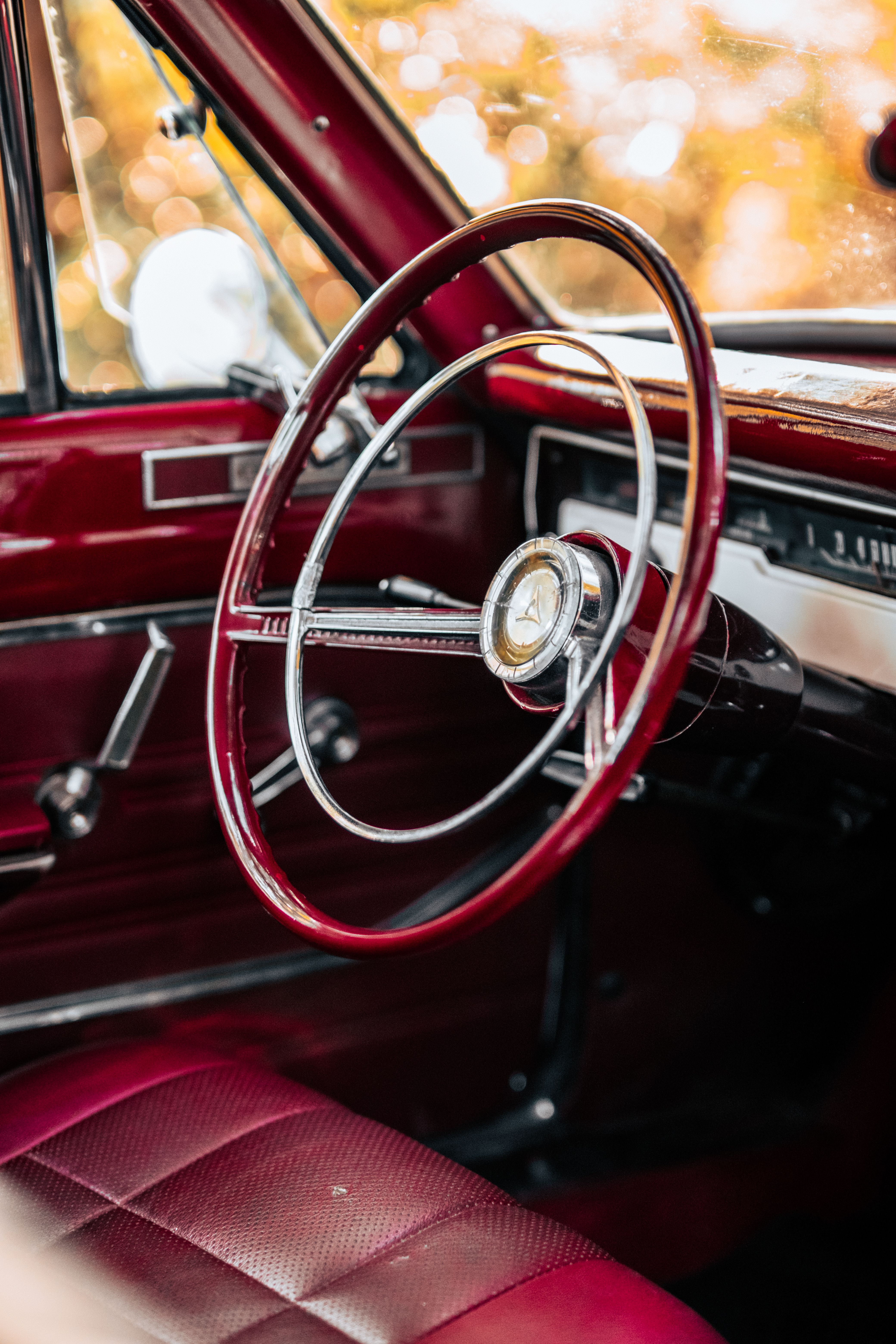 Vintage Red Car Interior with Classic Steering Wheel · Free Stock Photo