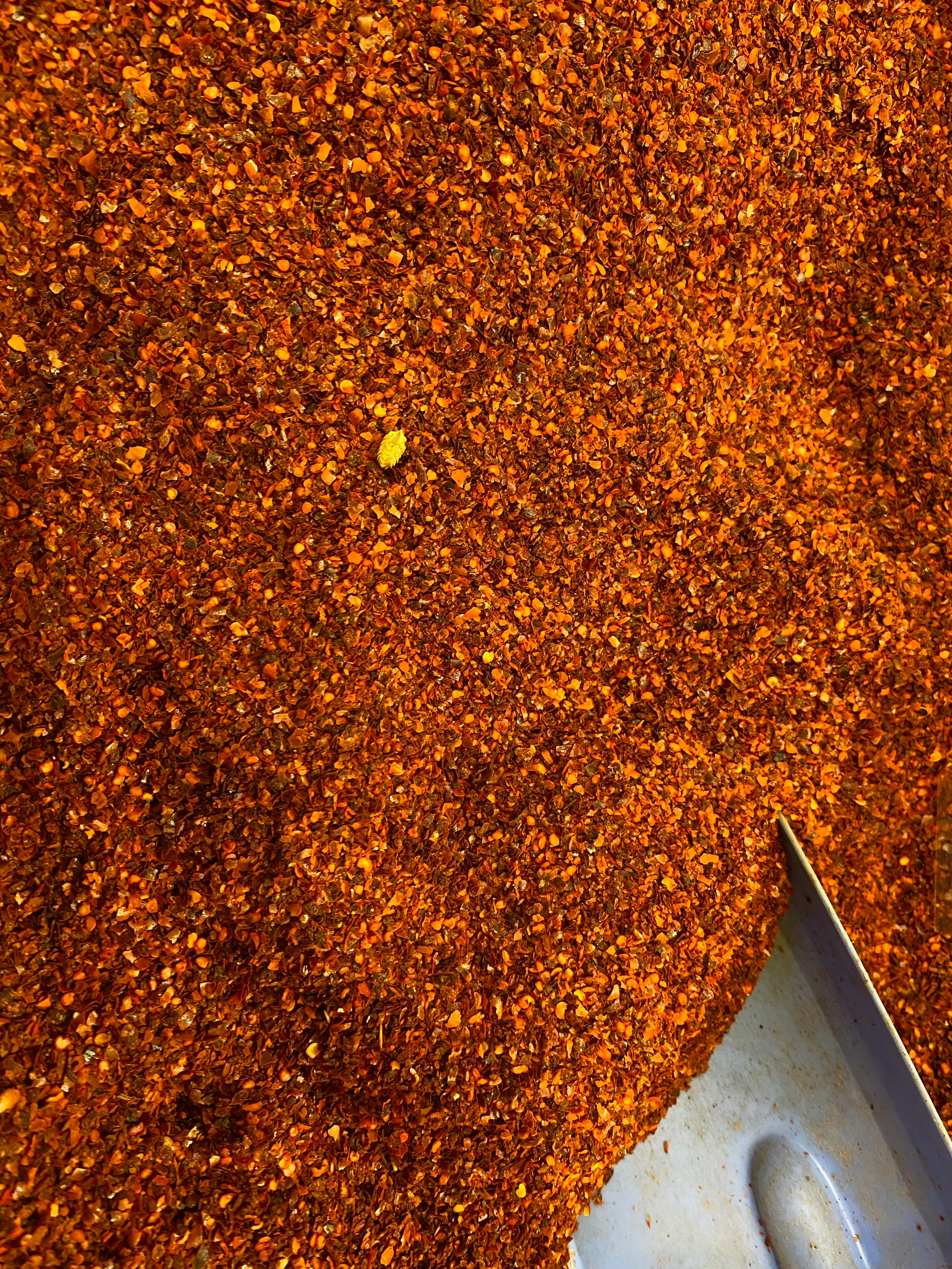 Spicy Red Chili Pepper Flakes Background · Free Stock Photo