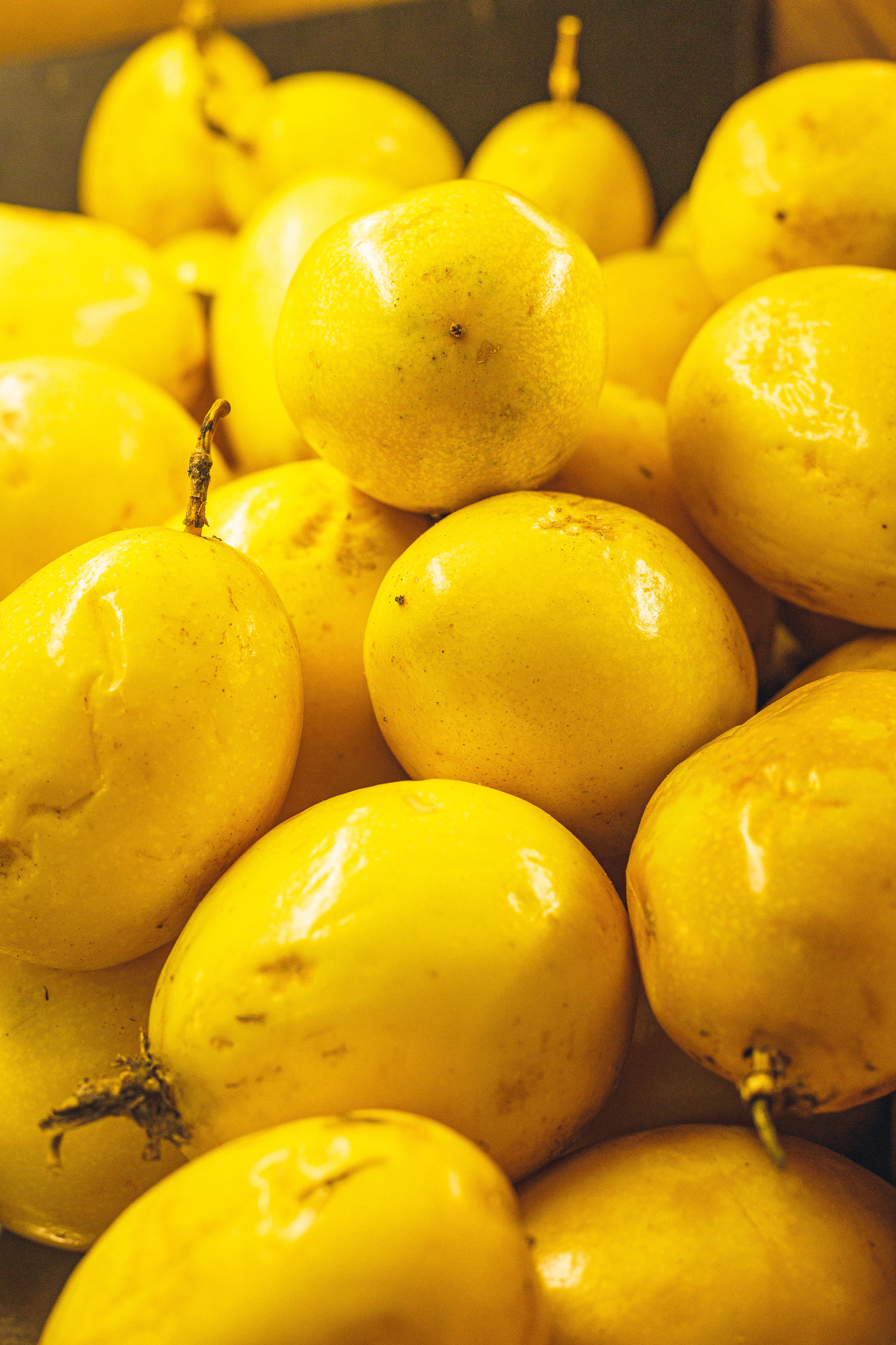 Close-Up of Fresh Yellow Passion Fruits · Free Stock Photo