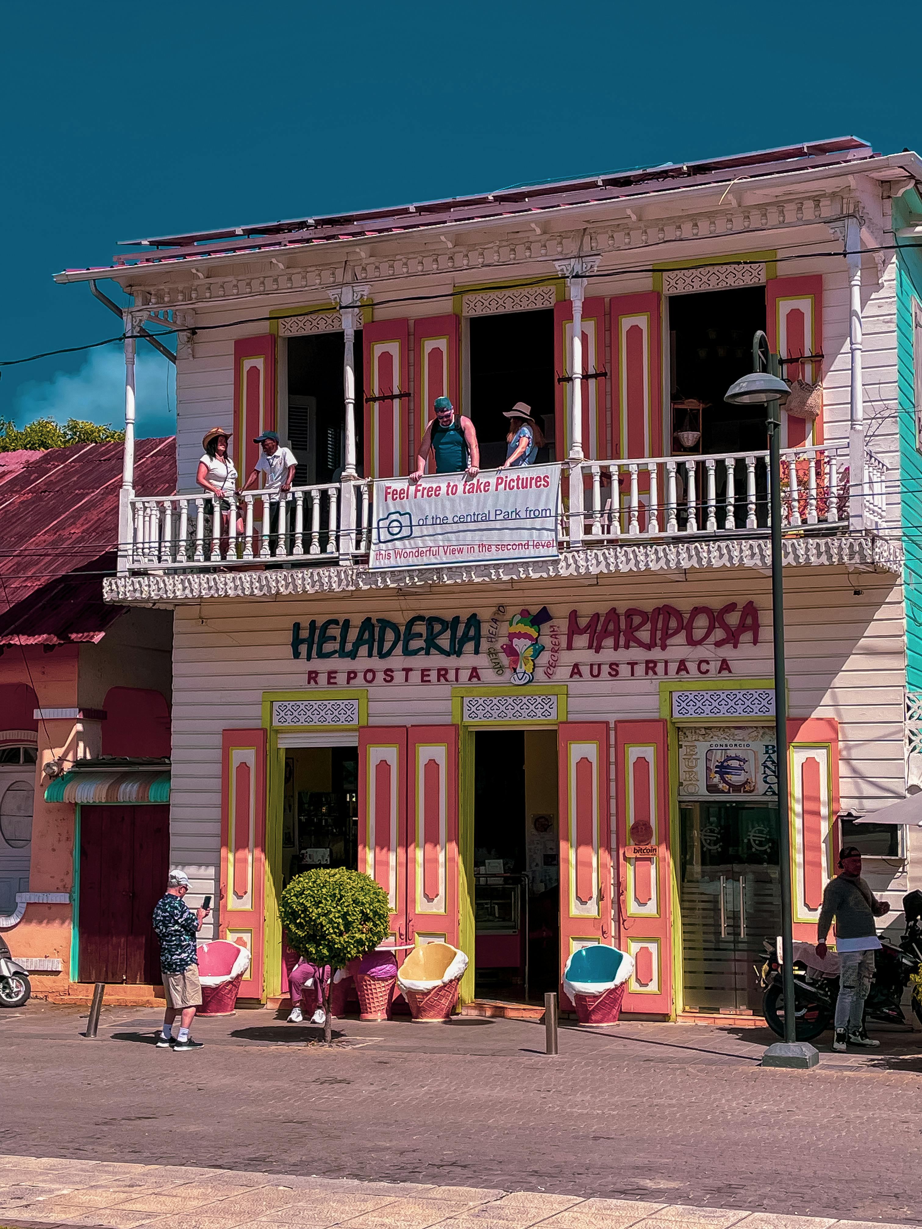 Colorful Colonial Ice Cream Shop with Balcony · Free Stock Photo