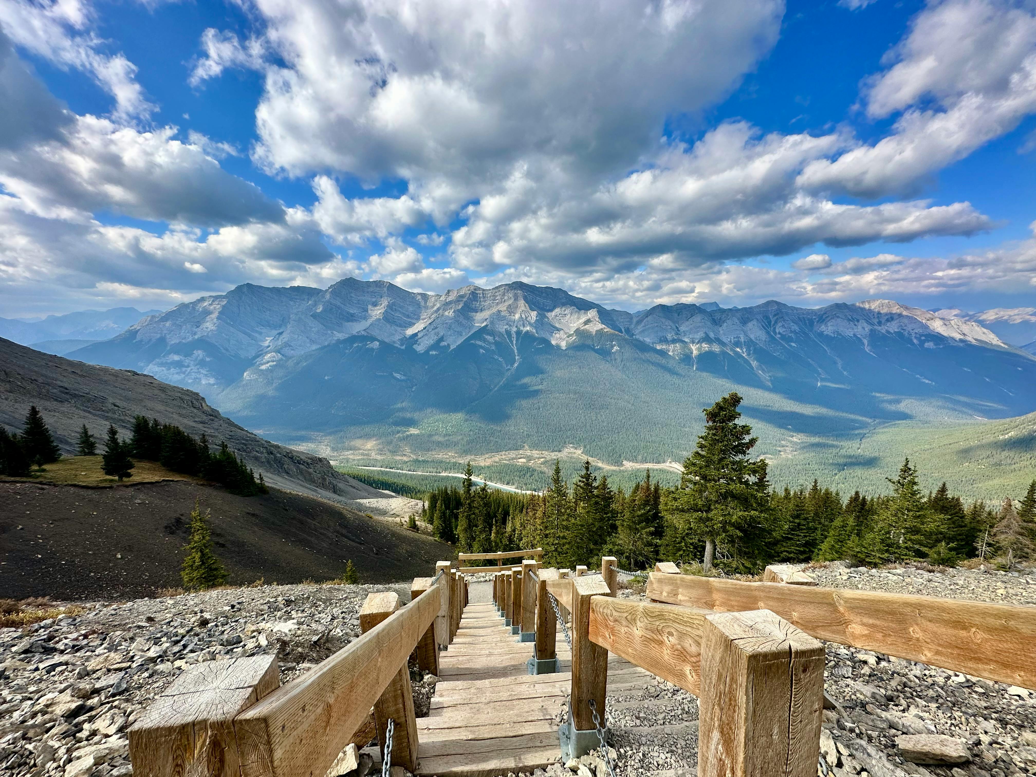 Breathtaking Mountain View with Wooden Pathway · Free Stock Photo