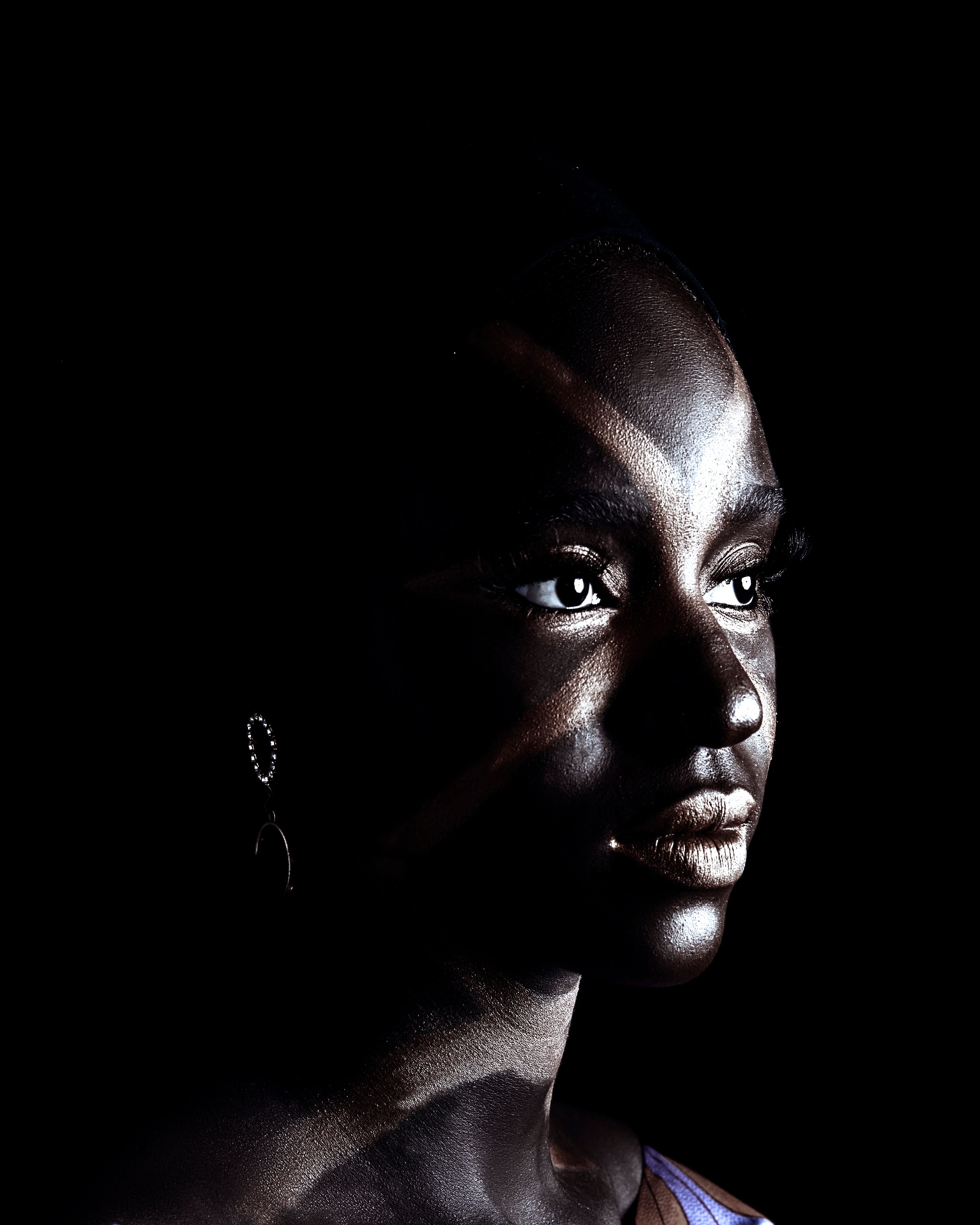 Dramatic Portrait of a Woman in Low Light · Free Stock Photo