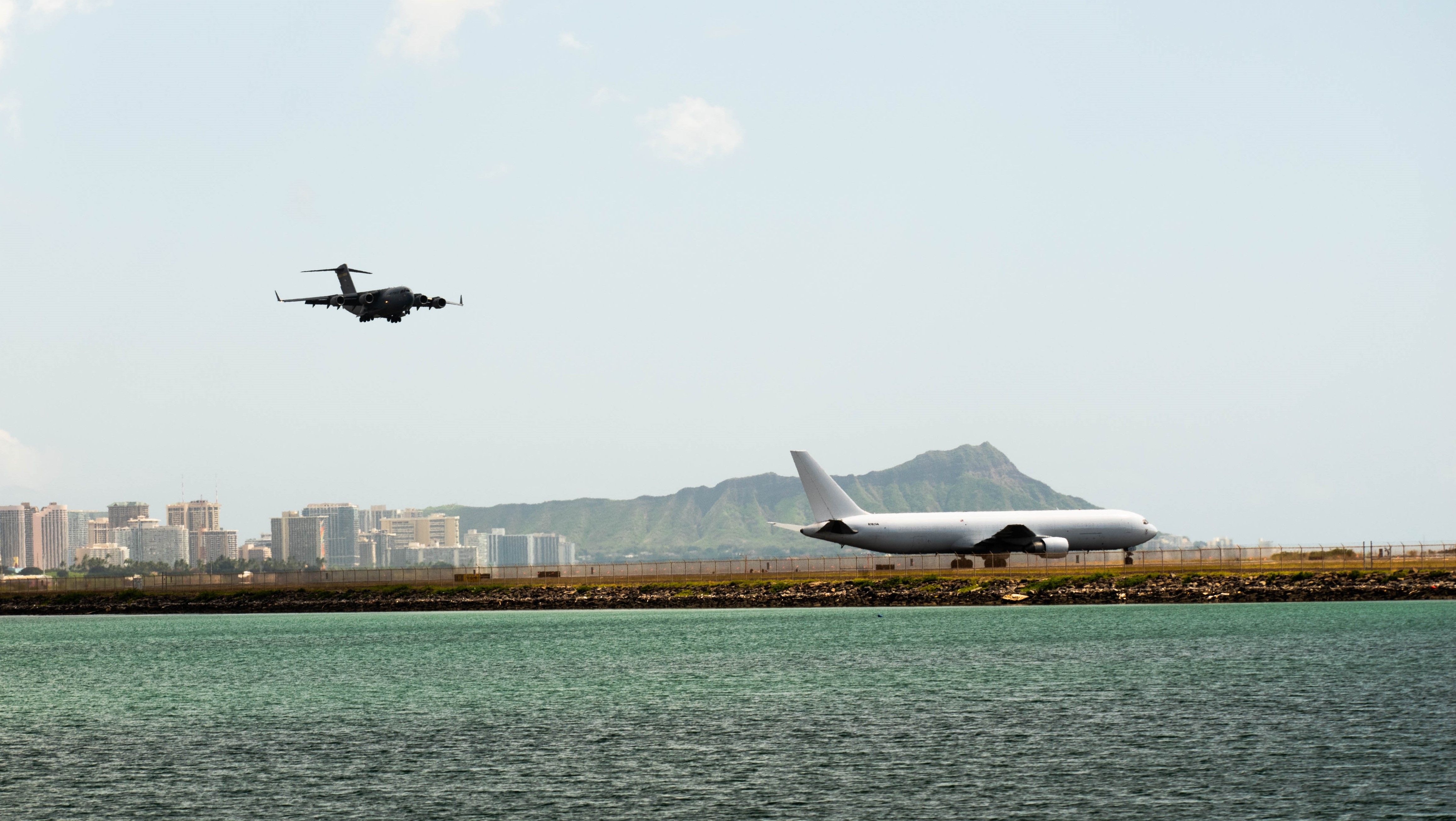 Military Aircraft Landing at Hawaiian Runway · Free Stock Photo