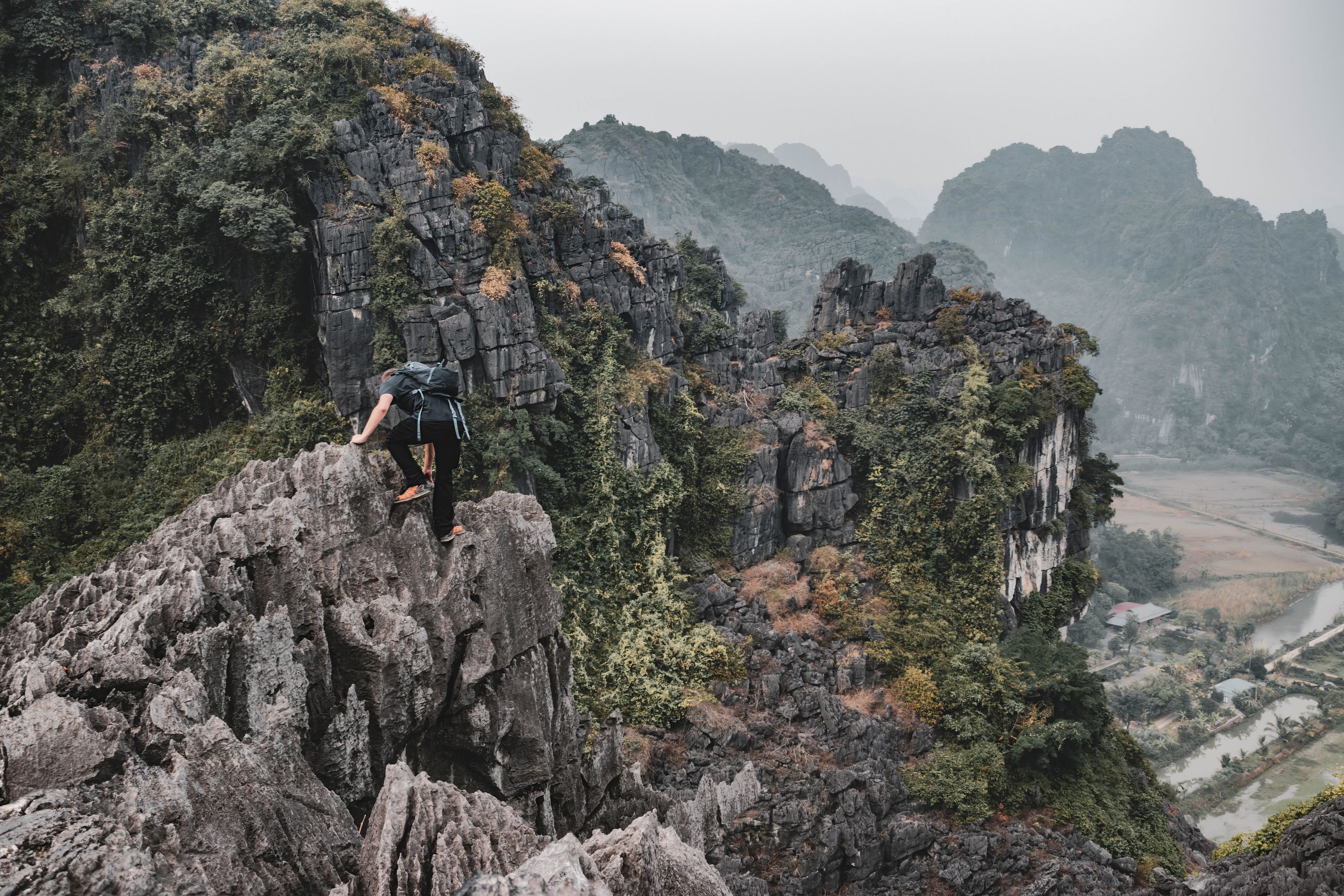 Adventurer Climbing Limestone Karst in Hoa Lư · Free Stock Photo