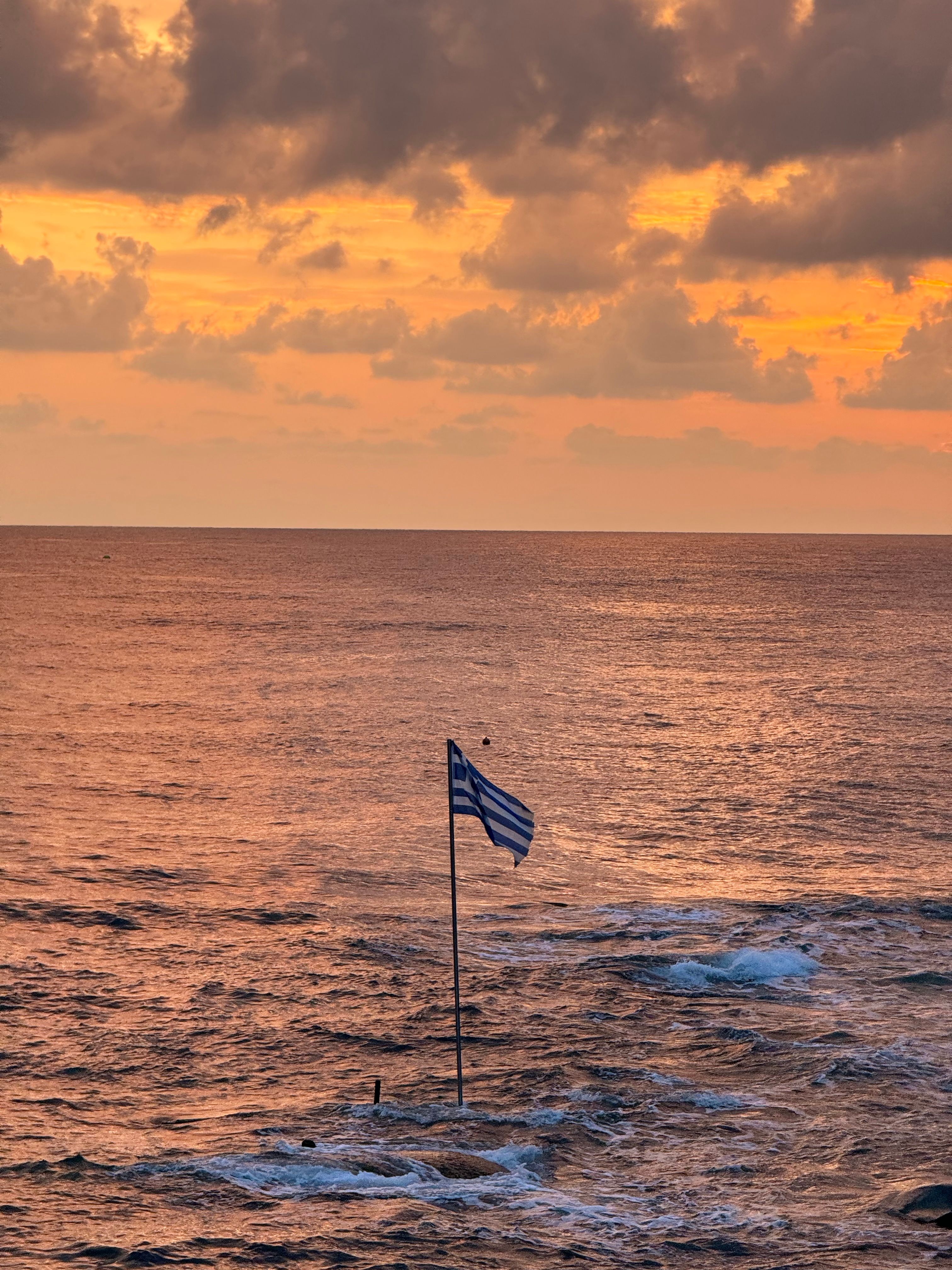 Greek Flag at Sunset Over the Sea in Greece · Free Stock Photo