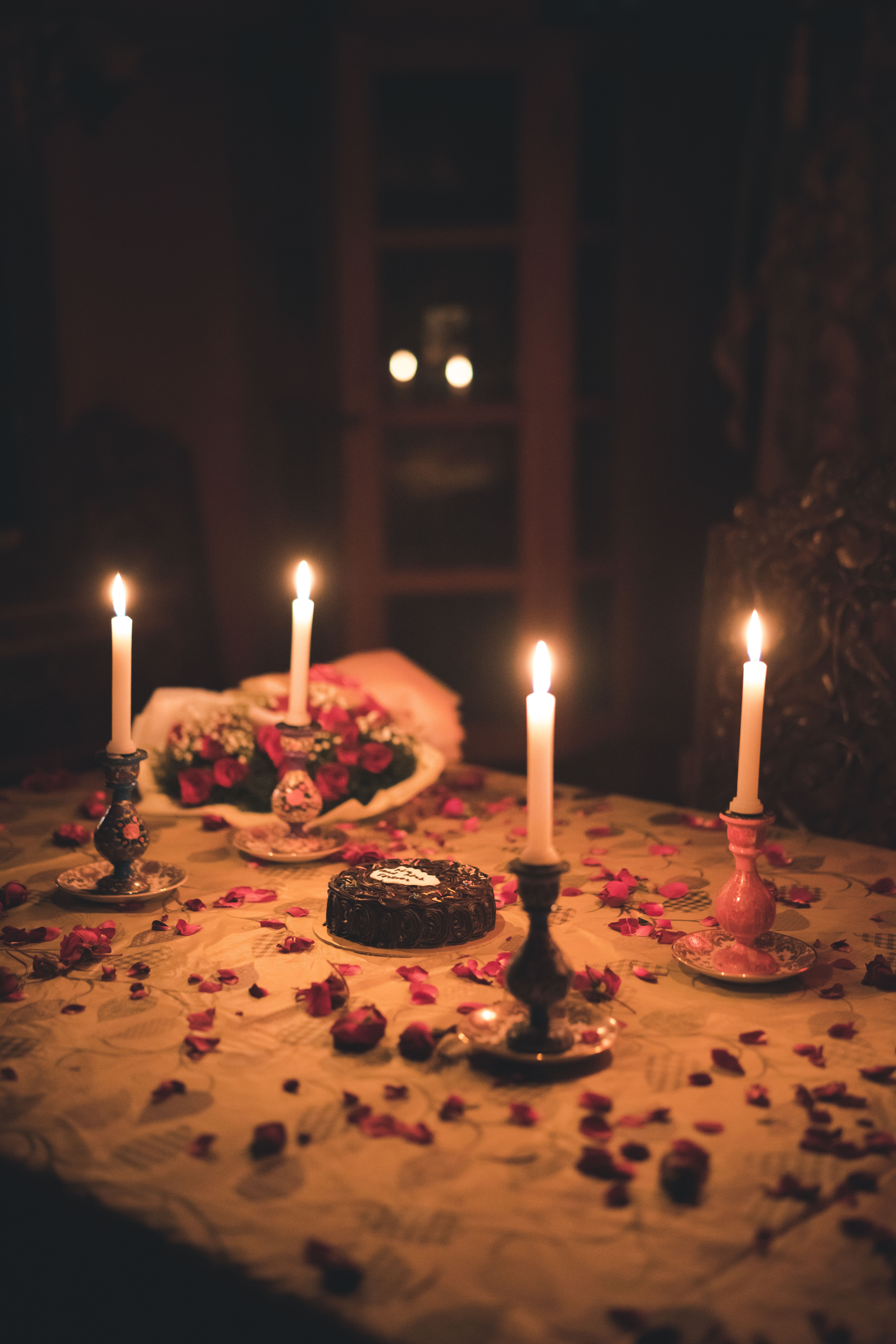 Cozy Candlelit Table with Floral Decor · Free Stock Photo