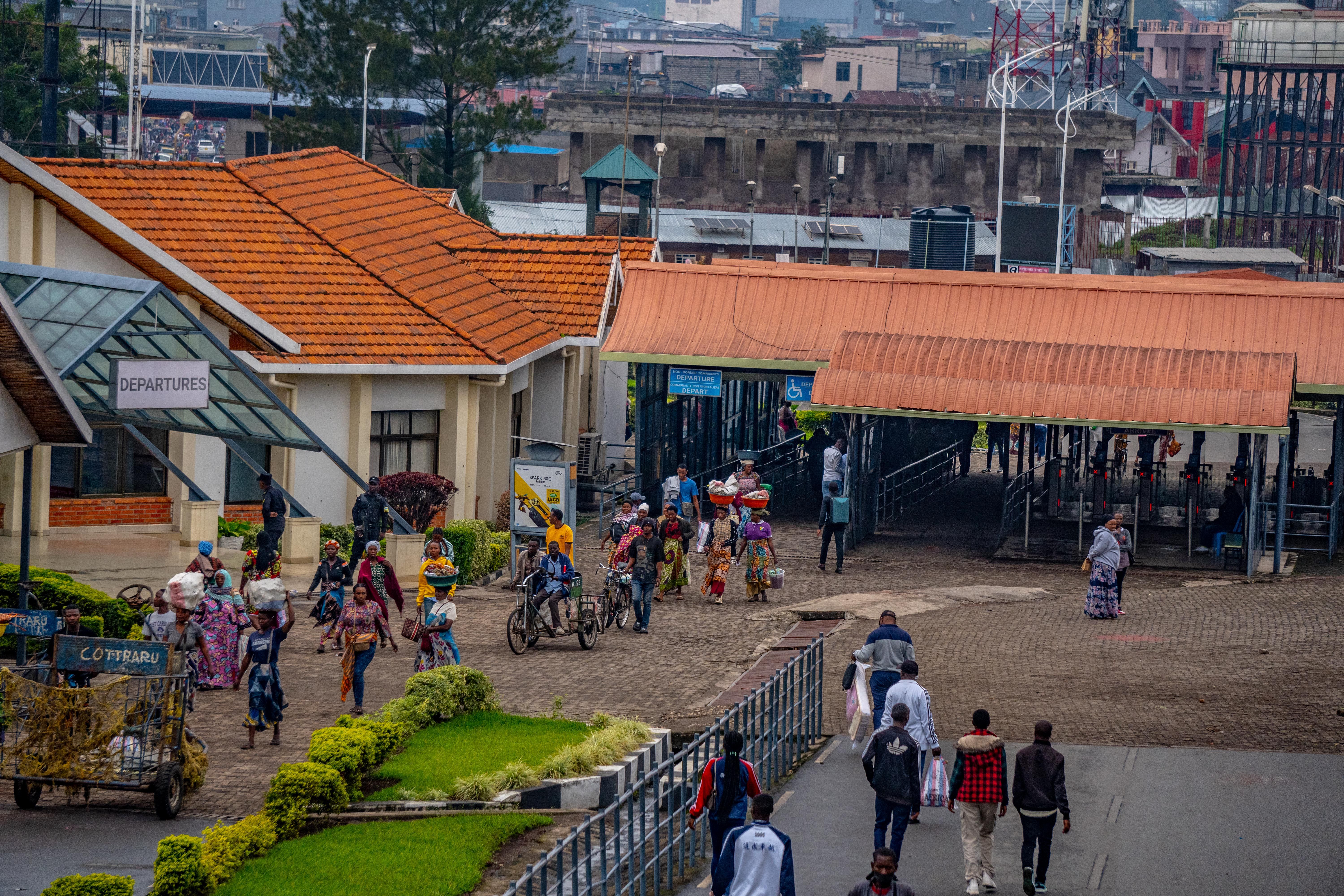 Crowded Urban Transport Hub with Orange Roofs · Free Stock Photo
