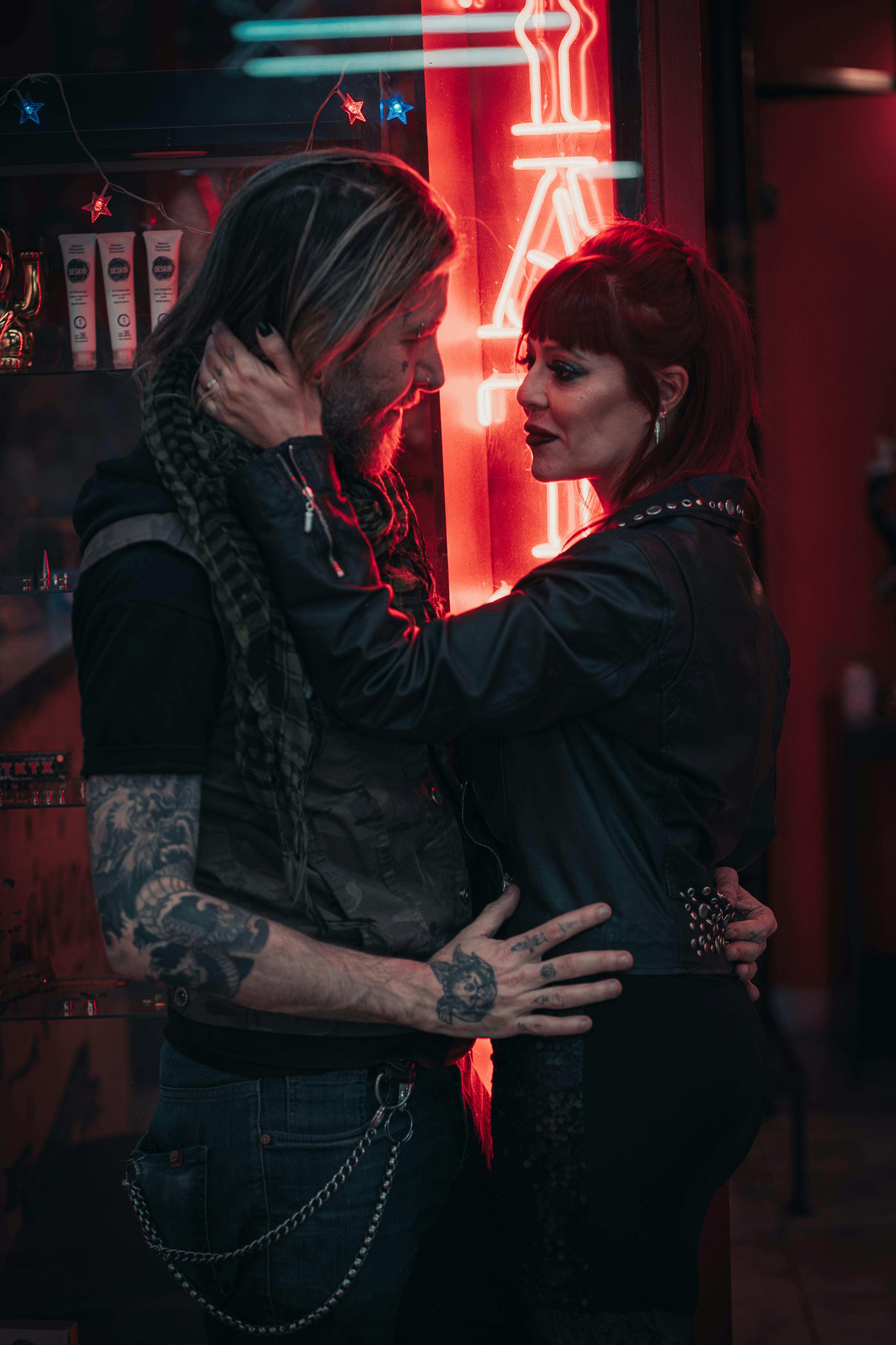 Romantic Couple Embracing in Neon Light · Free Stock Photo