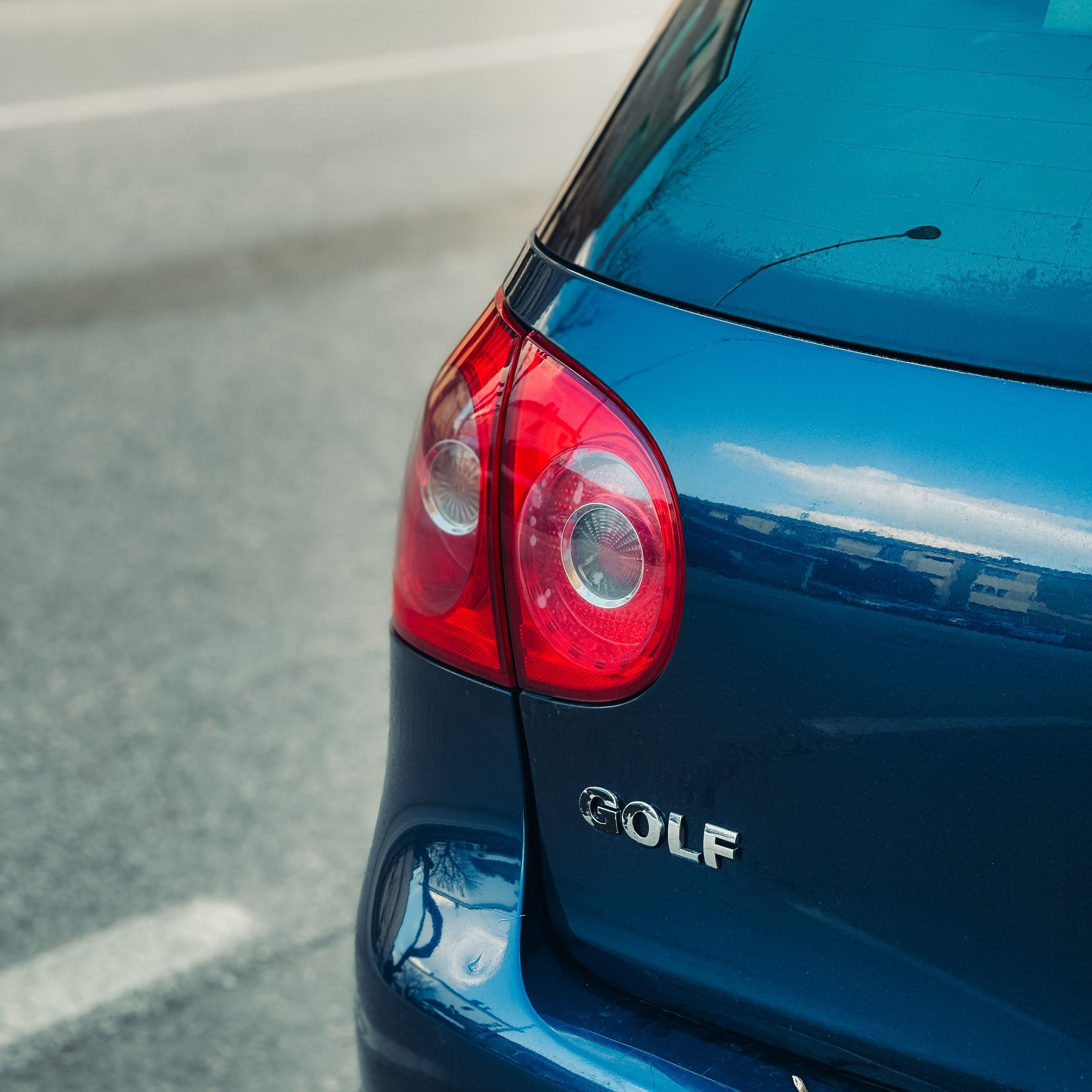 Close-up of Blue Car with Red Taillight on Street · Free Stock Photo