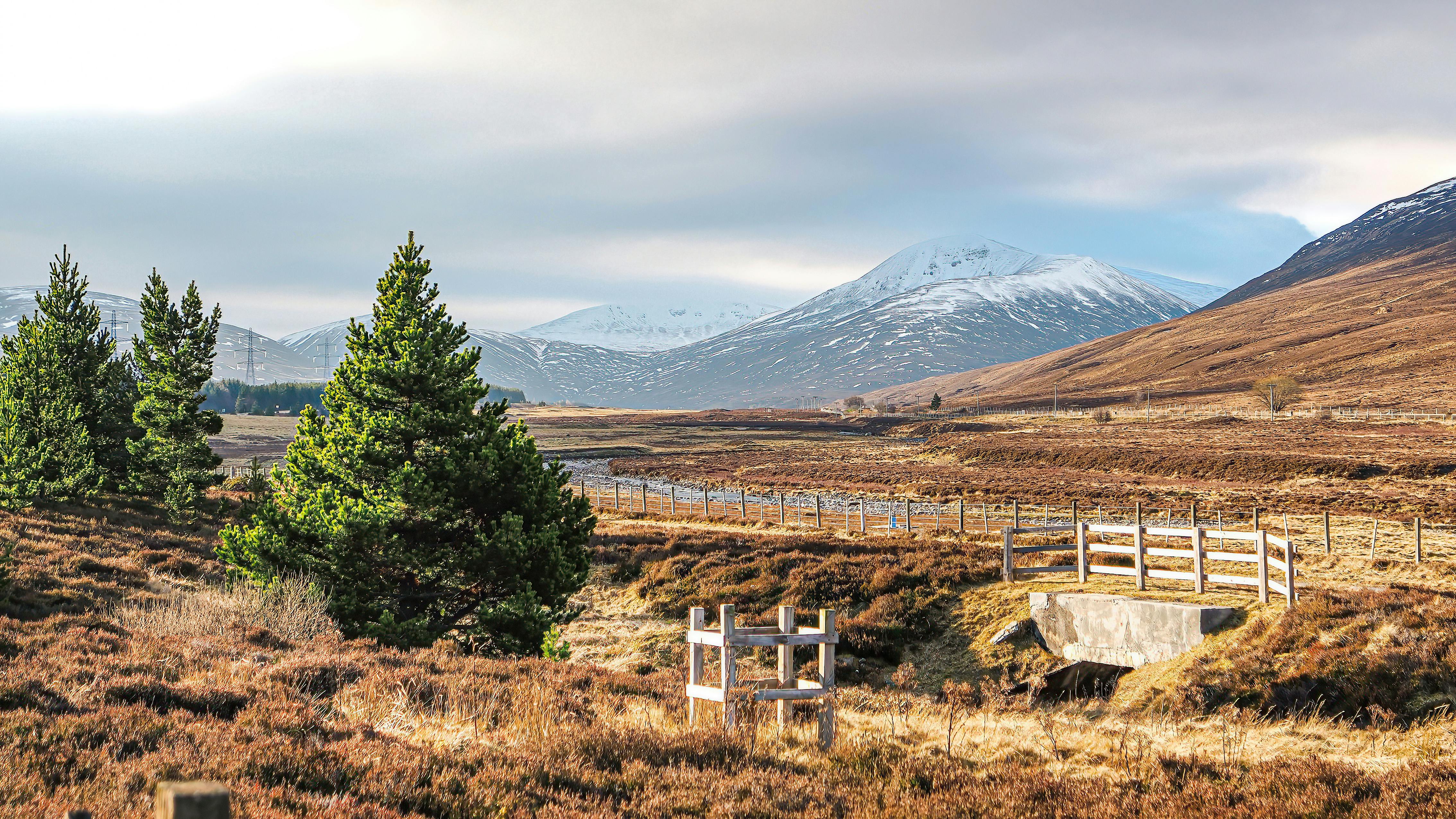 Scenic Highland Landscape with Snow-Capped Mountains · Free Stock Photo