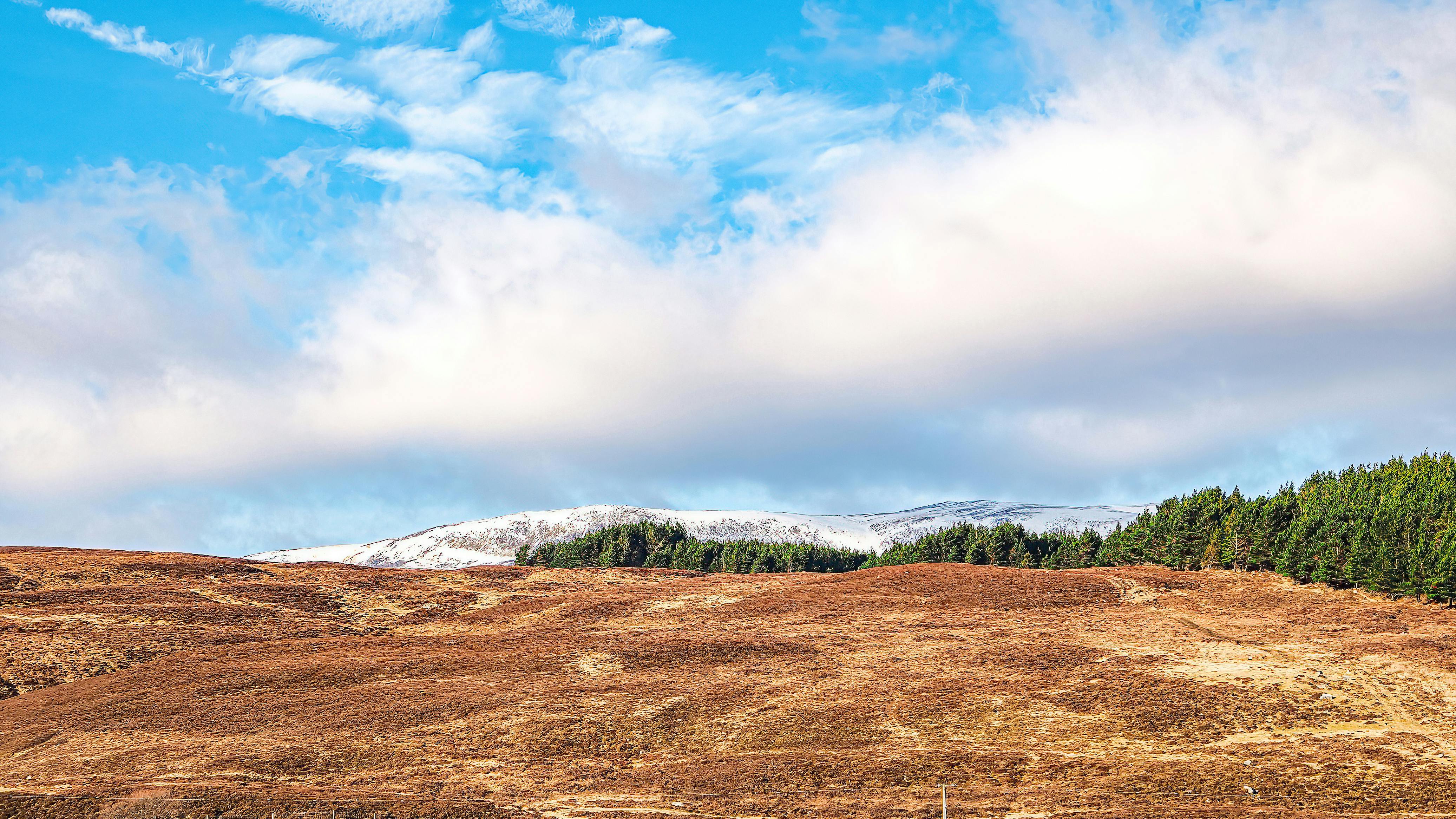 Vast Landscape with Snowy Mountains and Blue Sky · Free Stock Photo