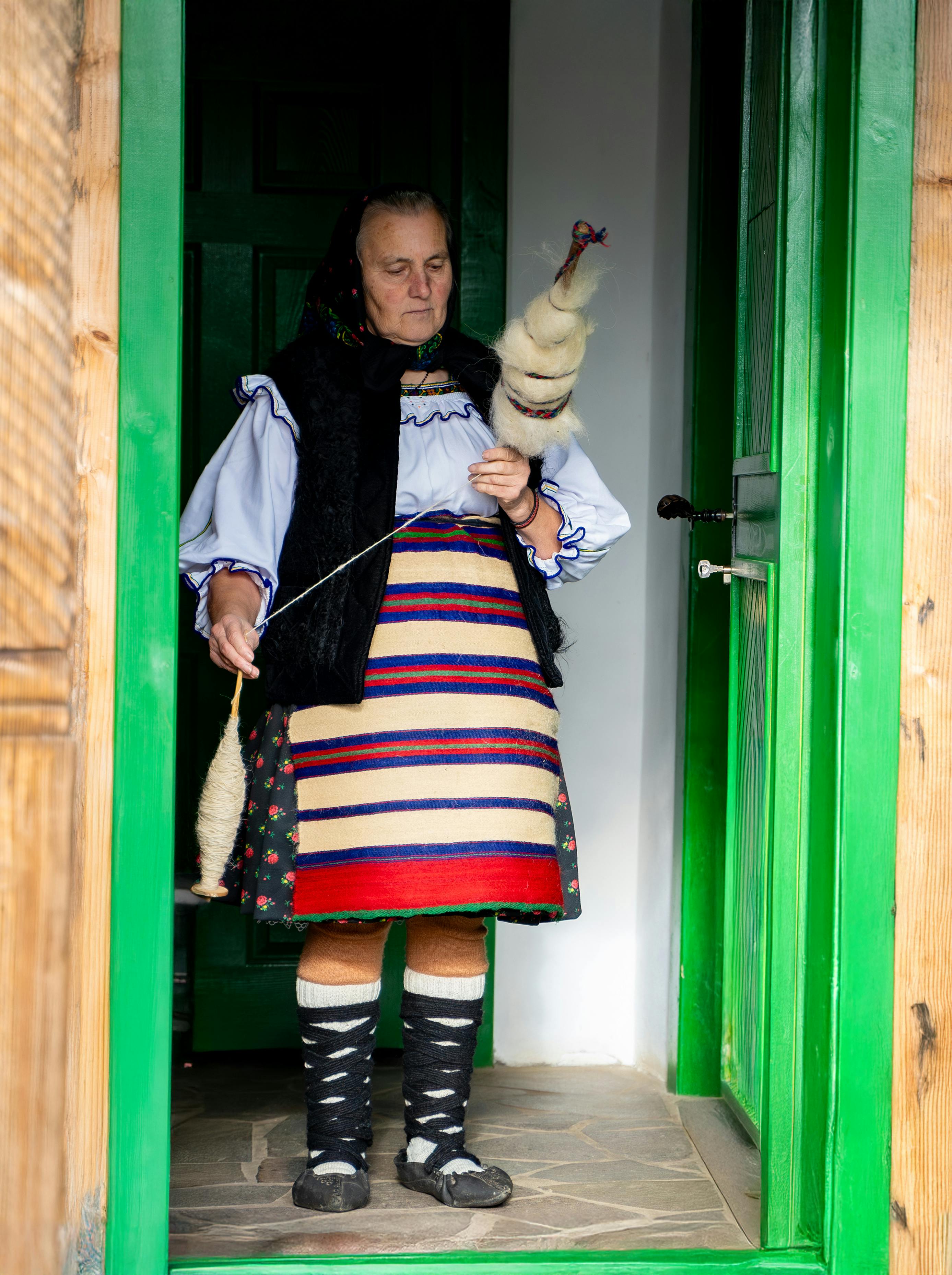 Traditional Spinner in Colorful Folk Costume · Free Stock Photo