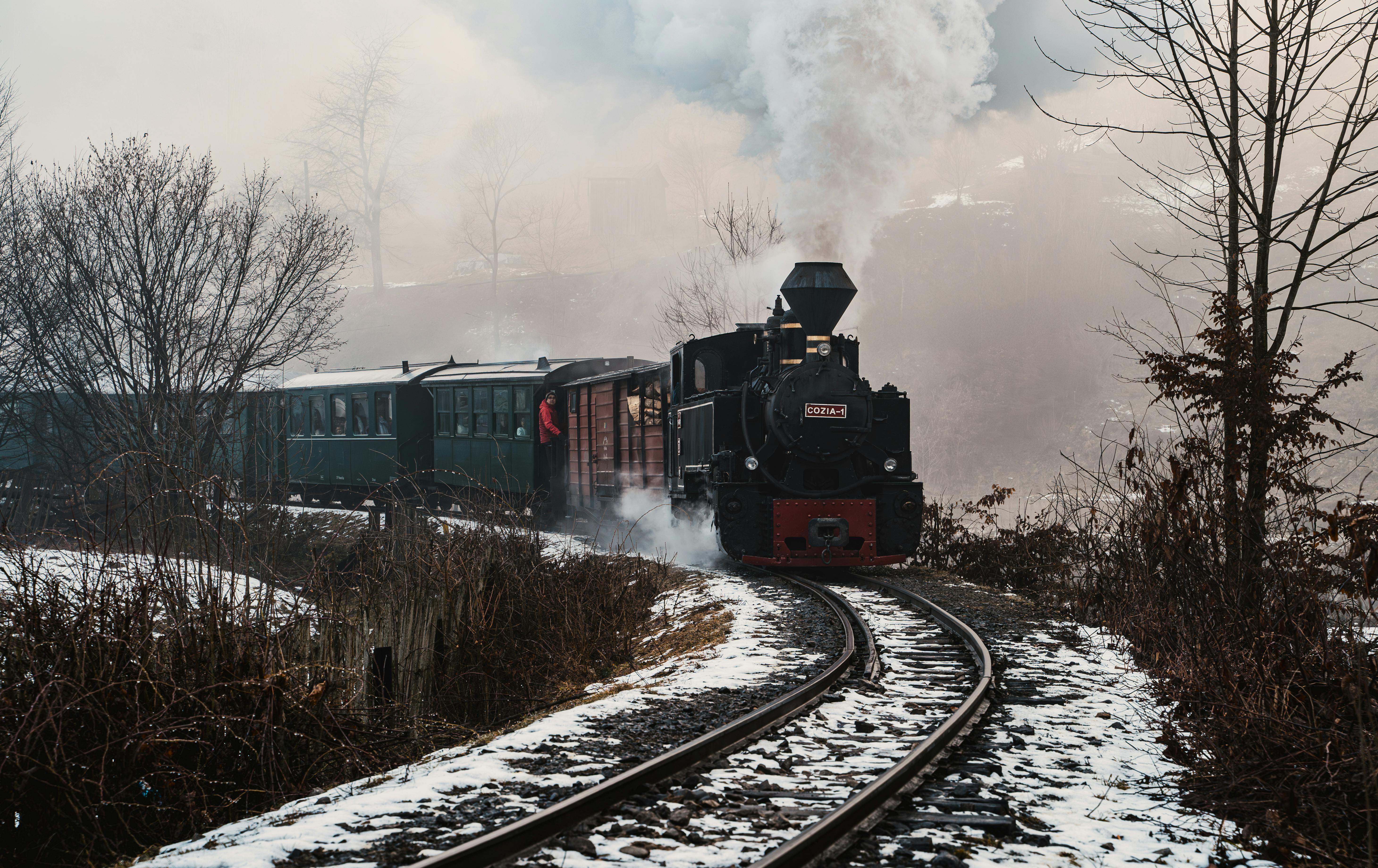 Vintage Steam Train in Snowy Maramures Landscape · Free Stock Photo