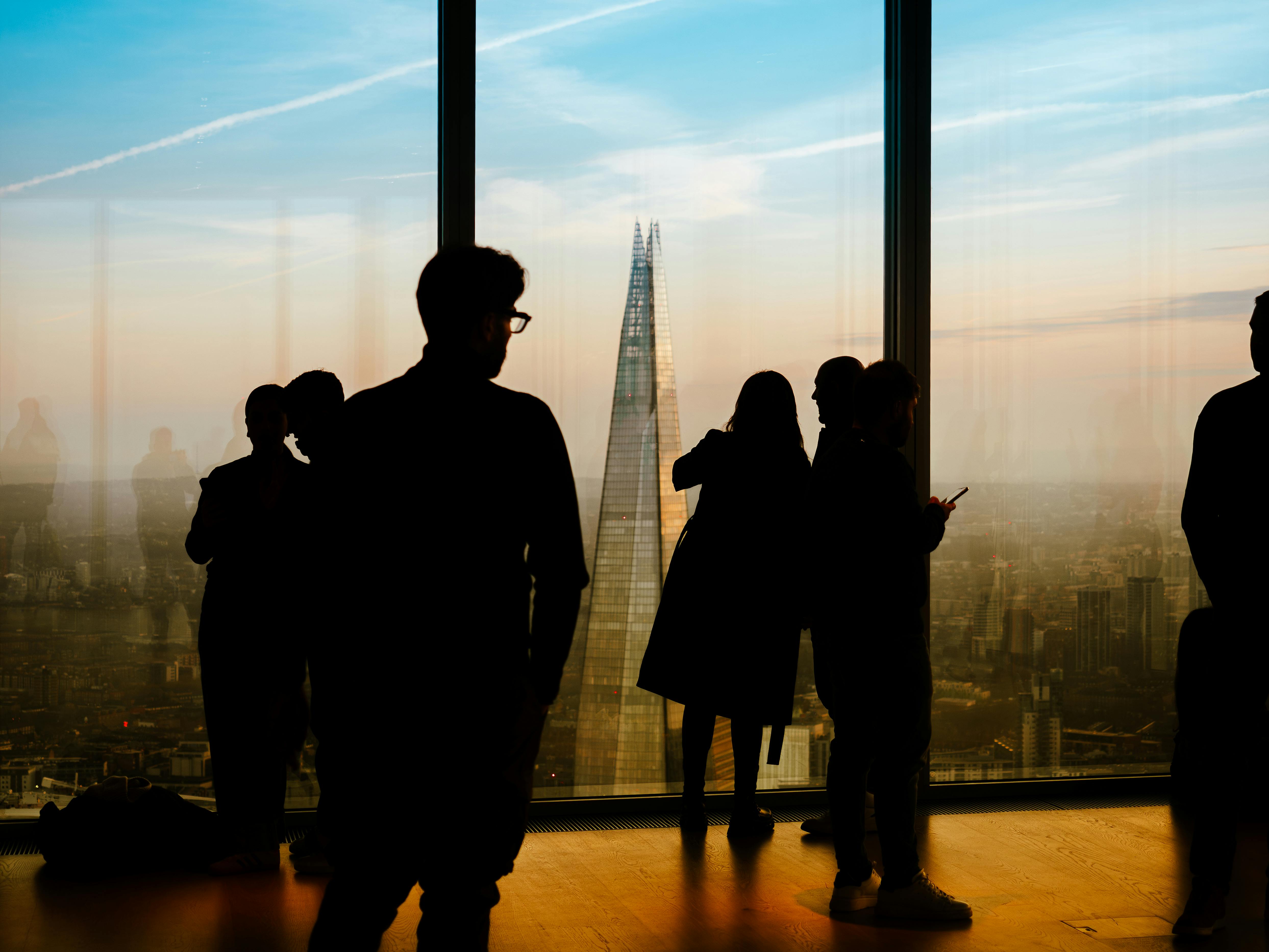Silhouette of People Overlooking London Skyline at Sunset · Free Stock ...