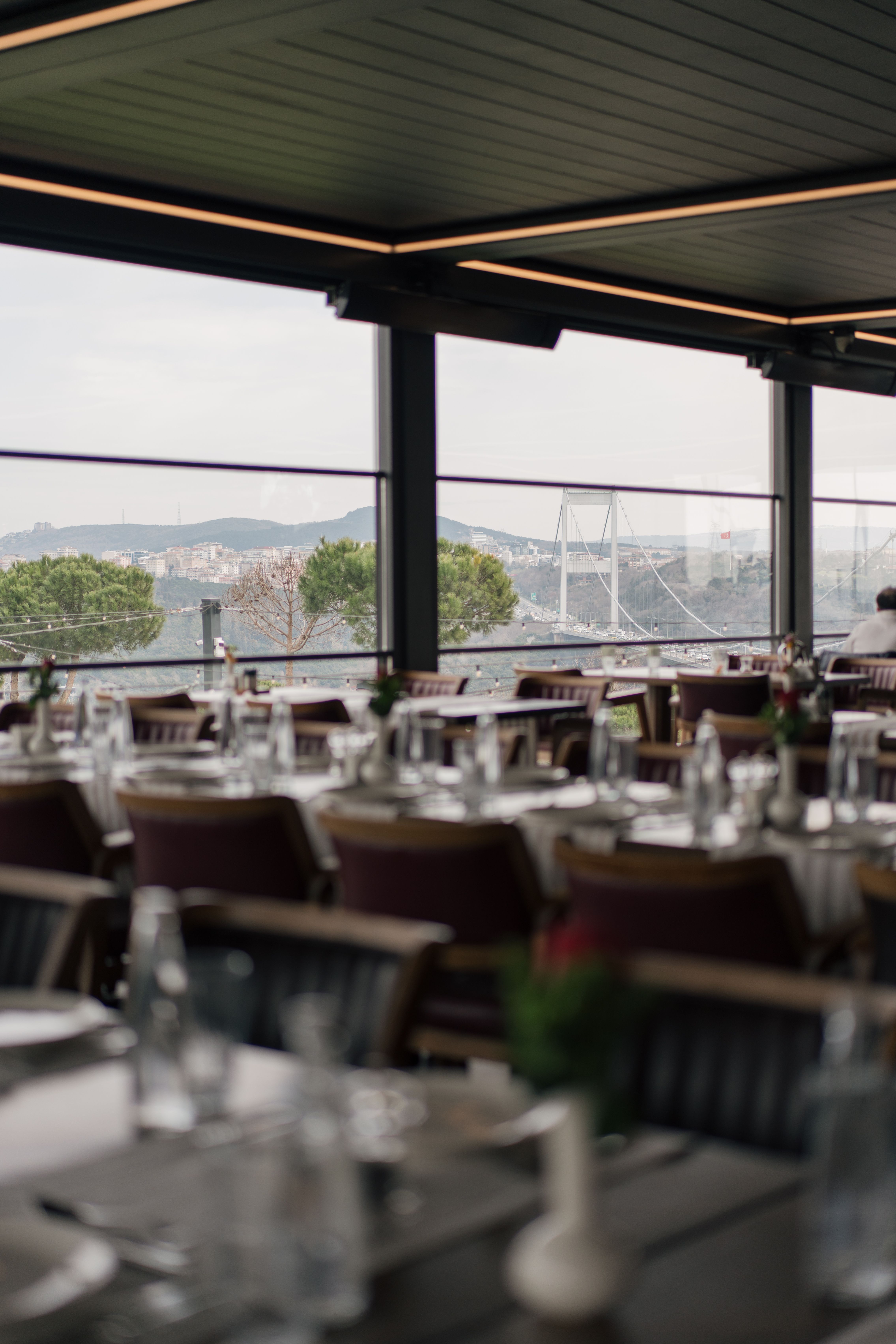 Scenic Restaurant Seating with City View · Free Stock Photo
