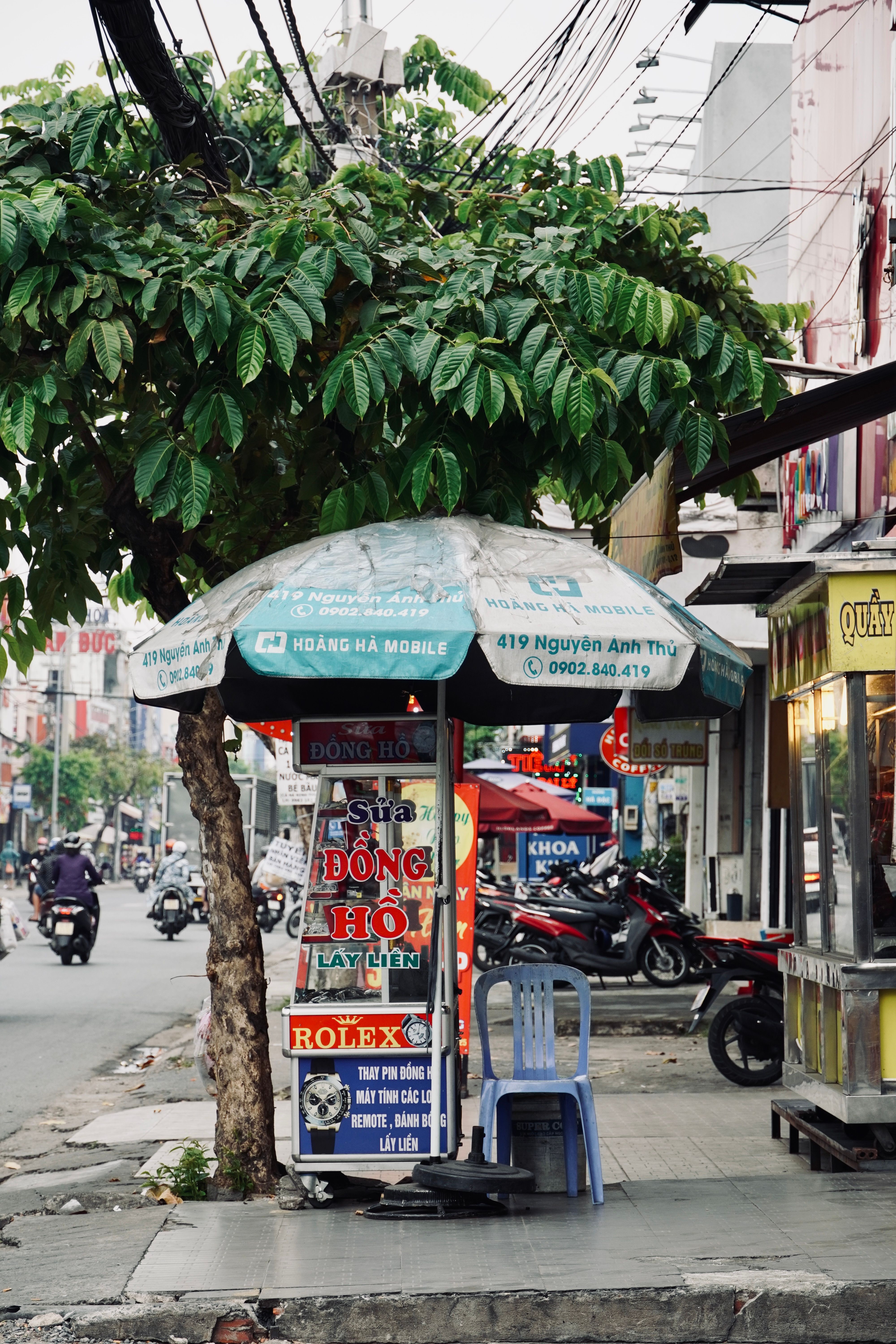 Street Vendor Stall in Urban Vietnamese Setting · Free Stock Photo