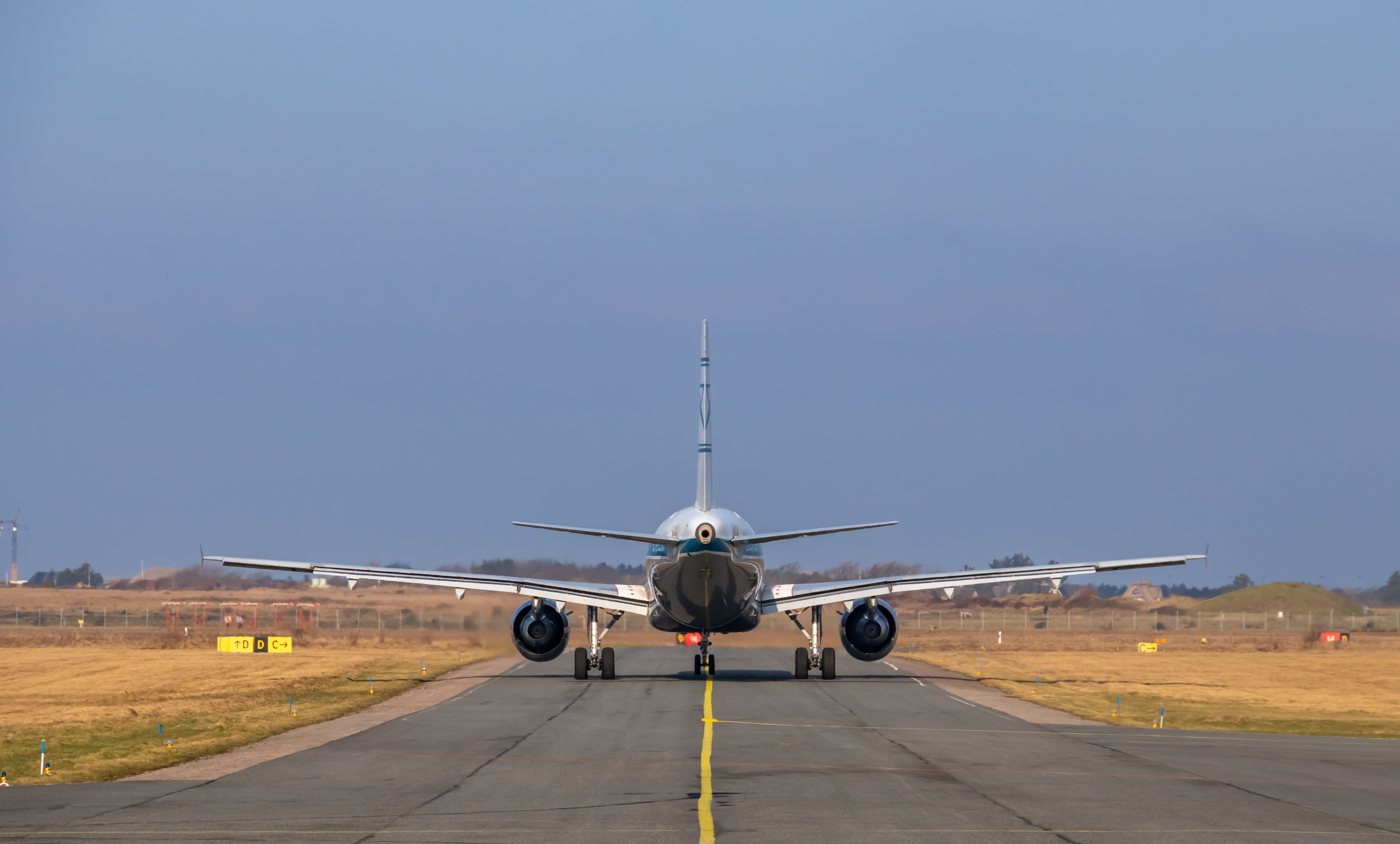 Commercial Aircraft on Airport Runway at Dawn · Free Stock Photo