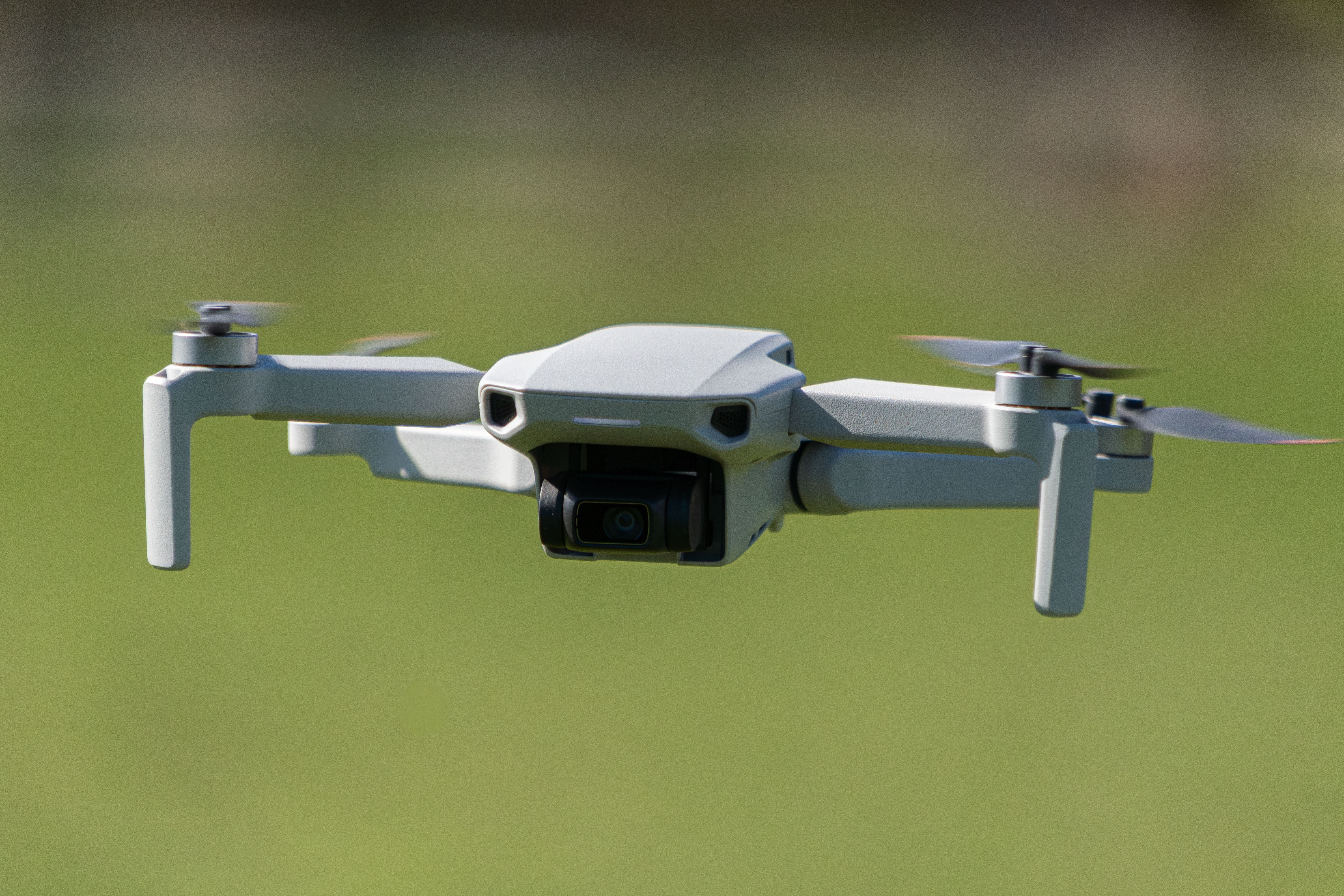 Drone in Flight Over Green Background in Leeds · Free Stock Photo
