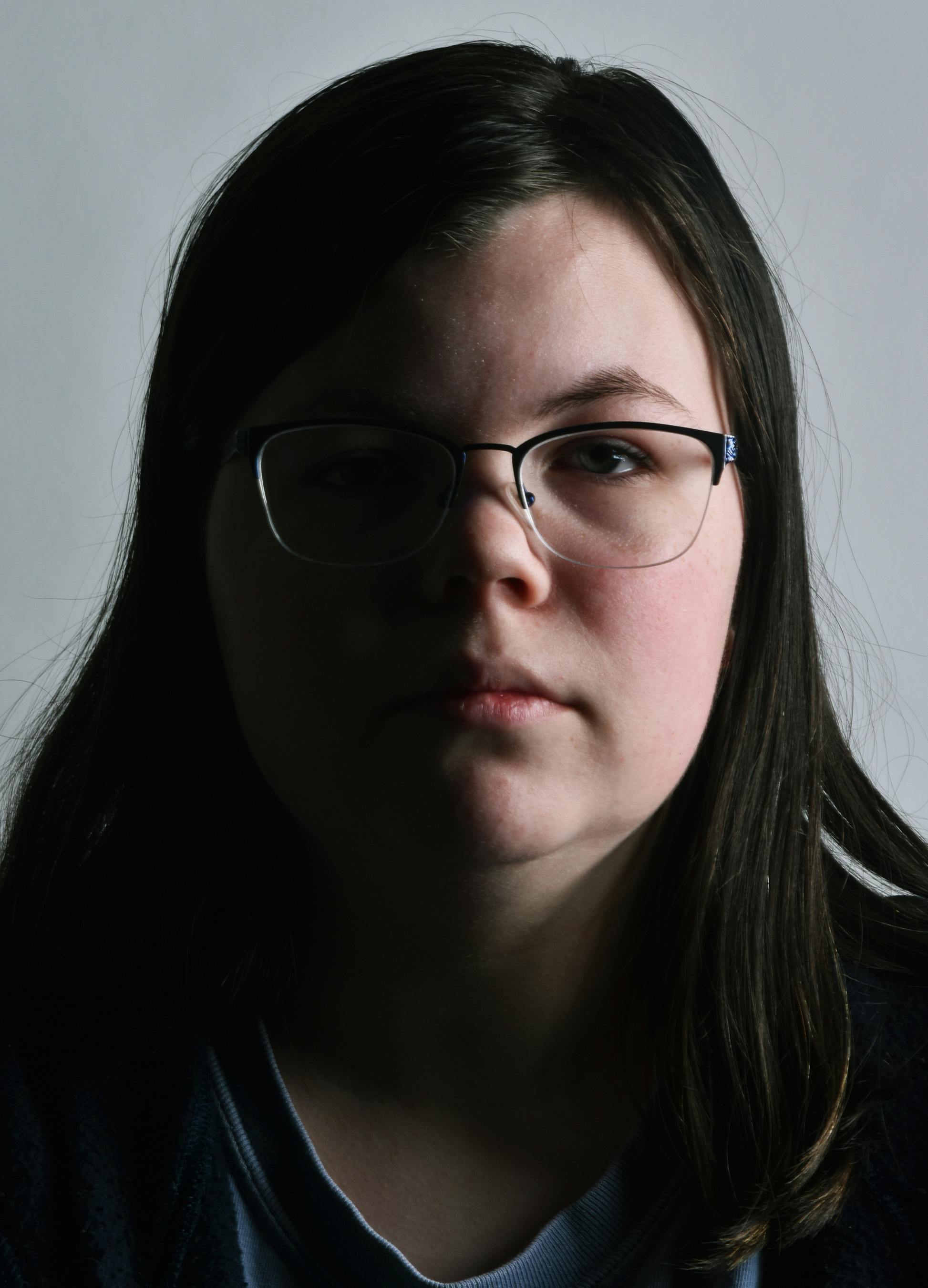 Moody Portrait of a Woman in Glasses · Free Stock Photo