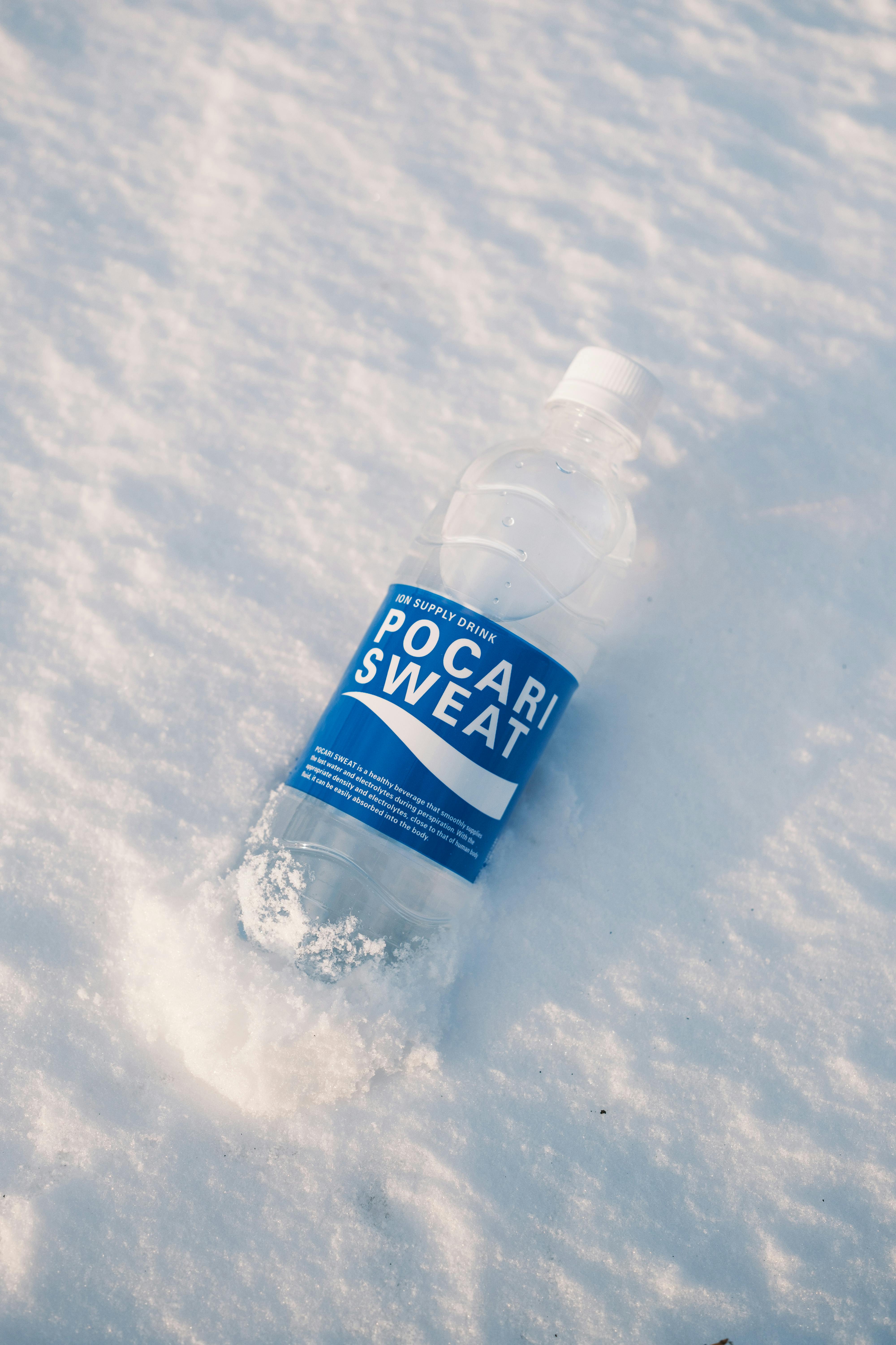 Pocari Sweat Bottle on Snow Background · Free Stock Photo