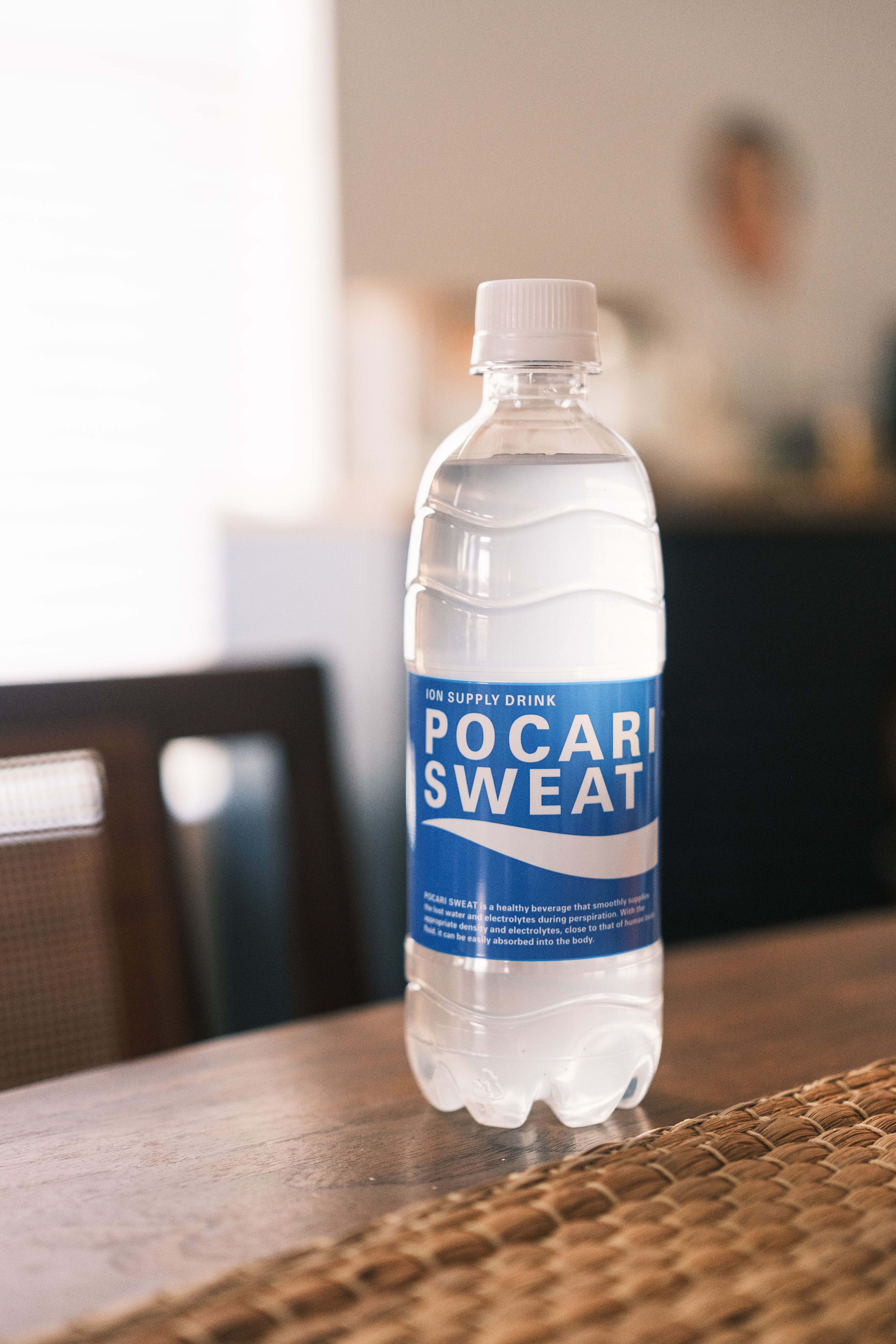 Pocari Sweat Bottle on Wooden Table · Free Stock Photo
