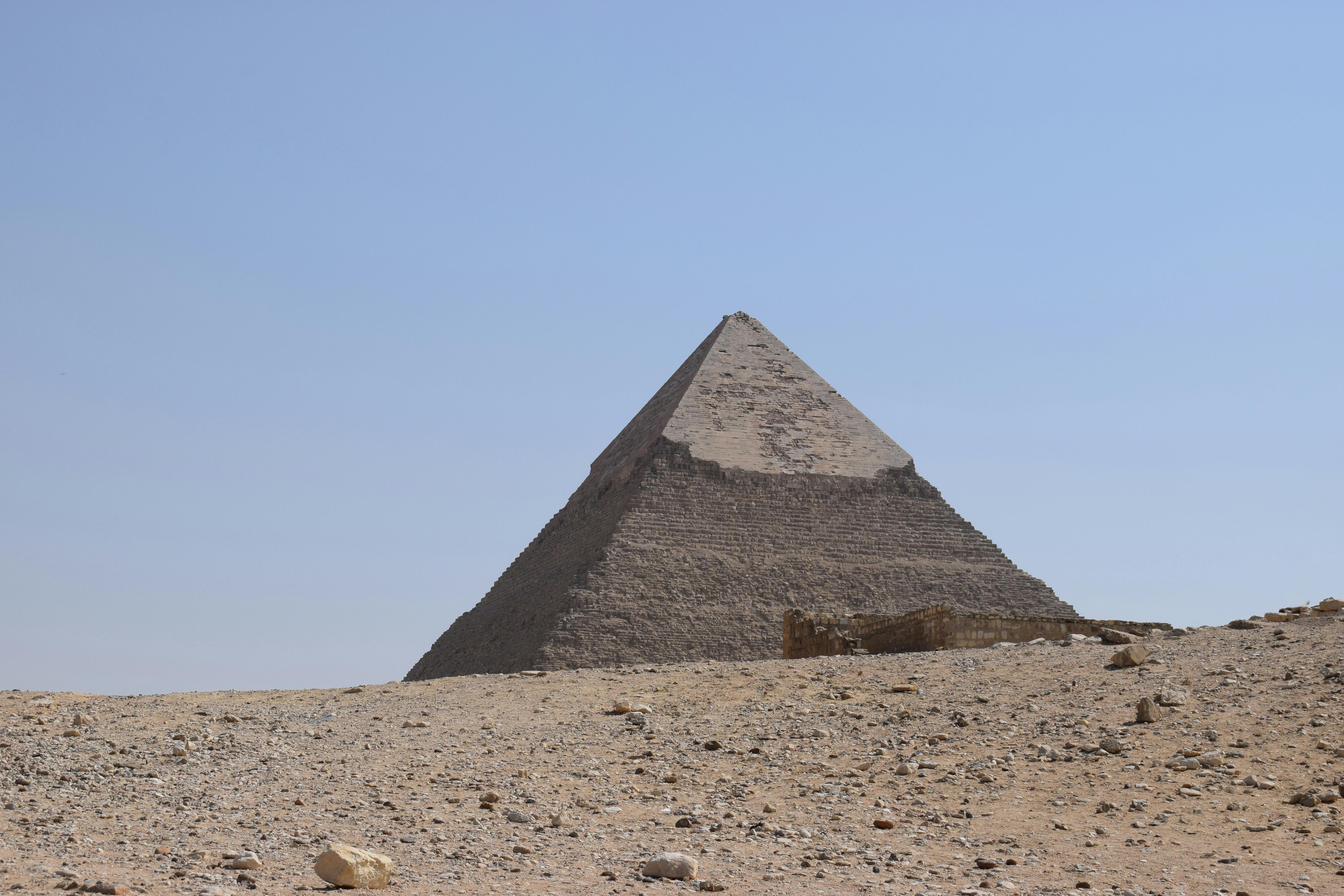 Grey Concrete Pyramids on the Middle of the Dessert during Daytime ...
