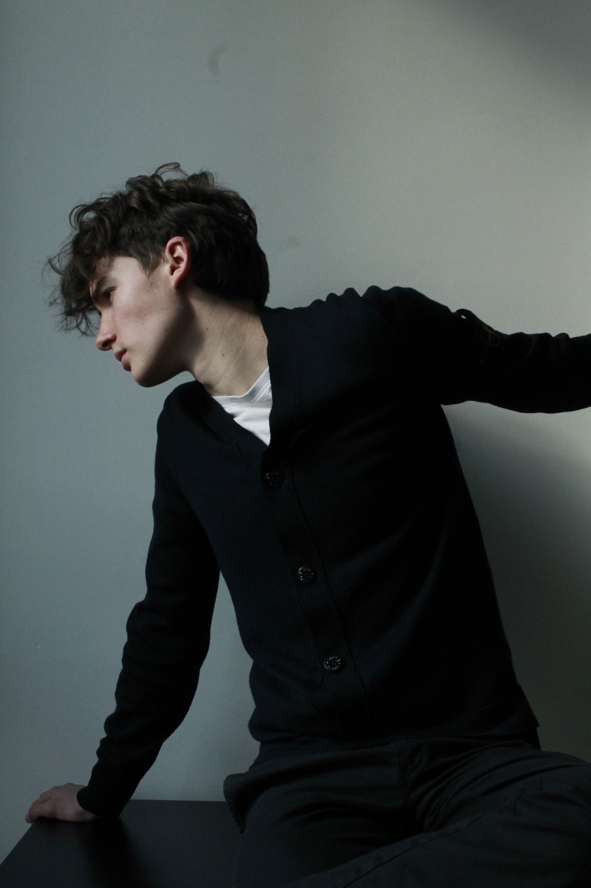 Thoughtful Young Man in Dramatic Lighting · Free Stock Photo