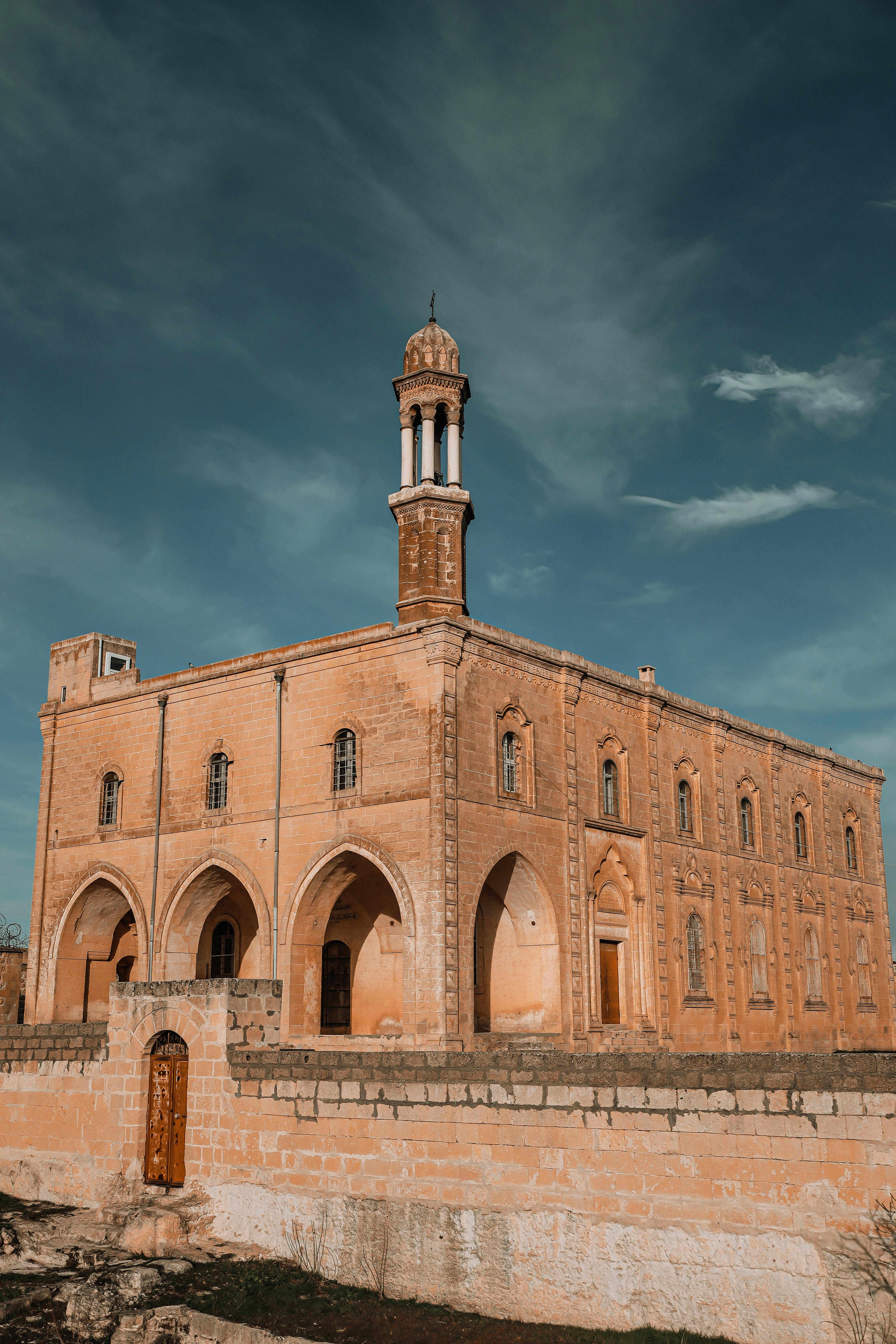 Historic Bell Tower Church in Dramatic Light · Free Stock Photo