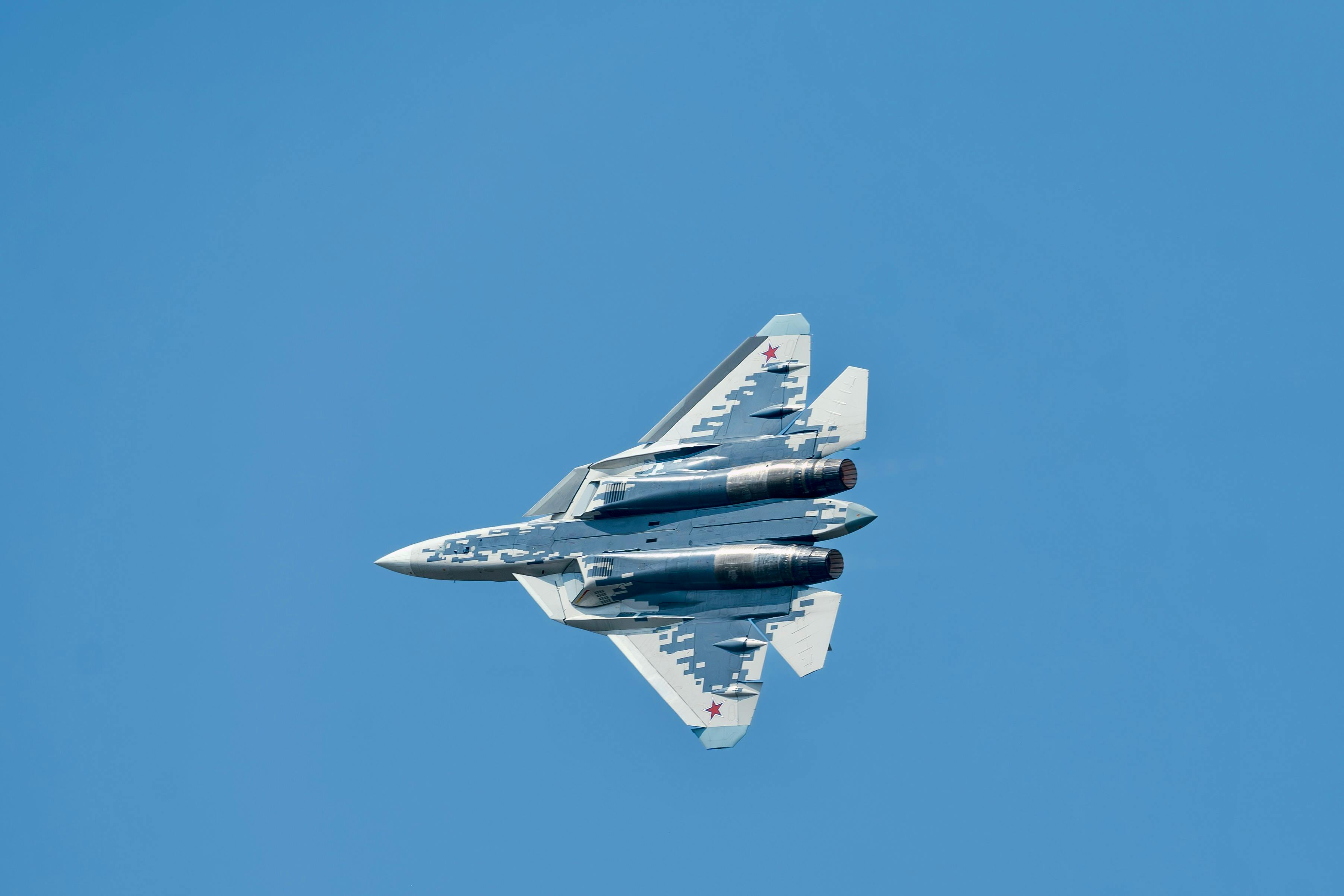 Sukhoi Fighter Jet in Flight Against Clear Sky · Free Stock Photo
