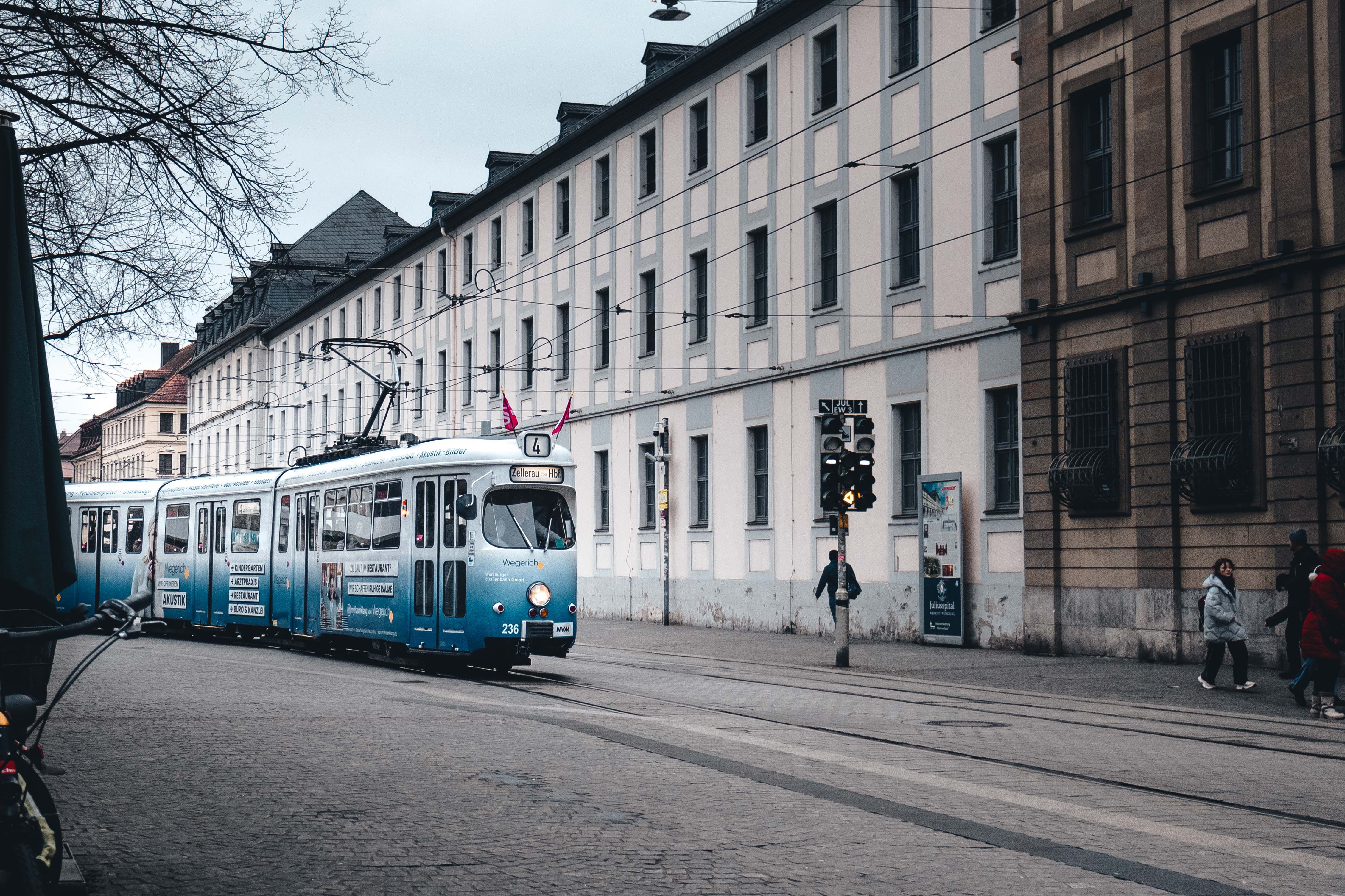 Charming European Street with Classic Tram · Free Stock Photo