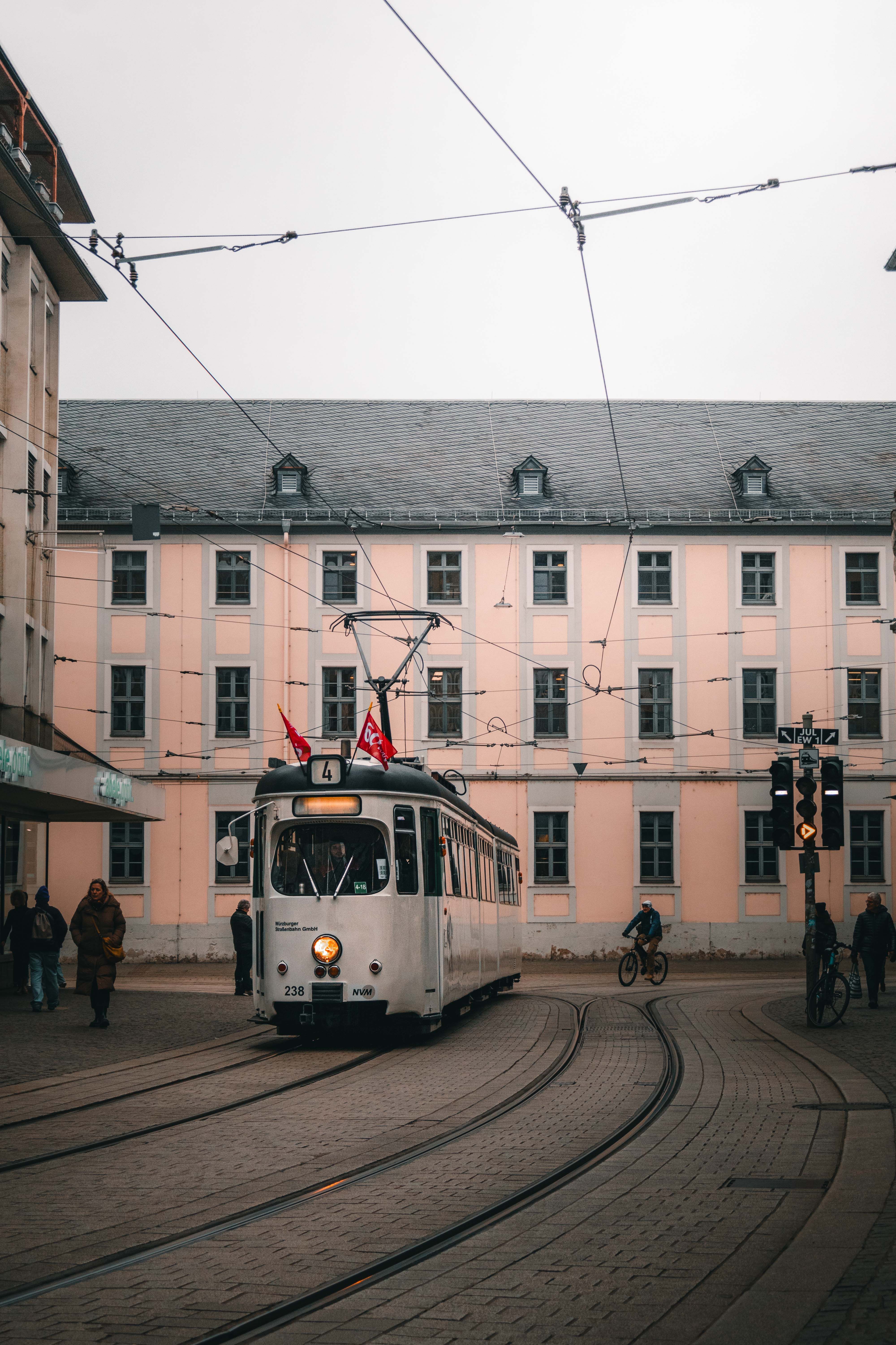 Historic Tram Navigating European City Street · Free Stock Photo