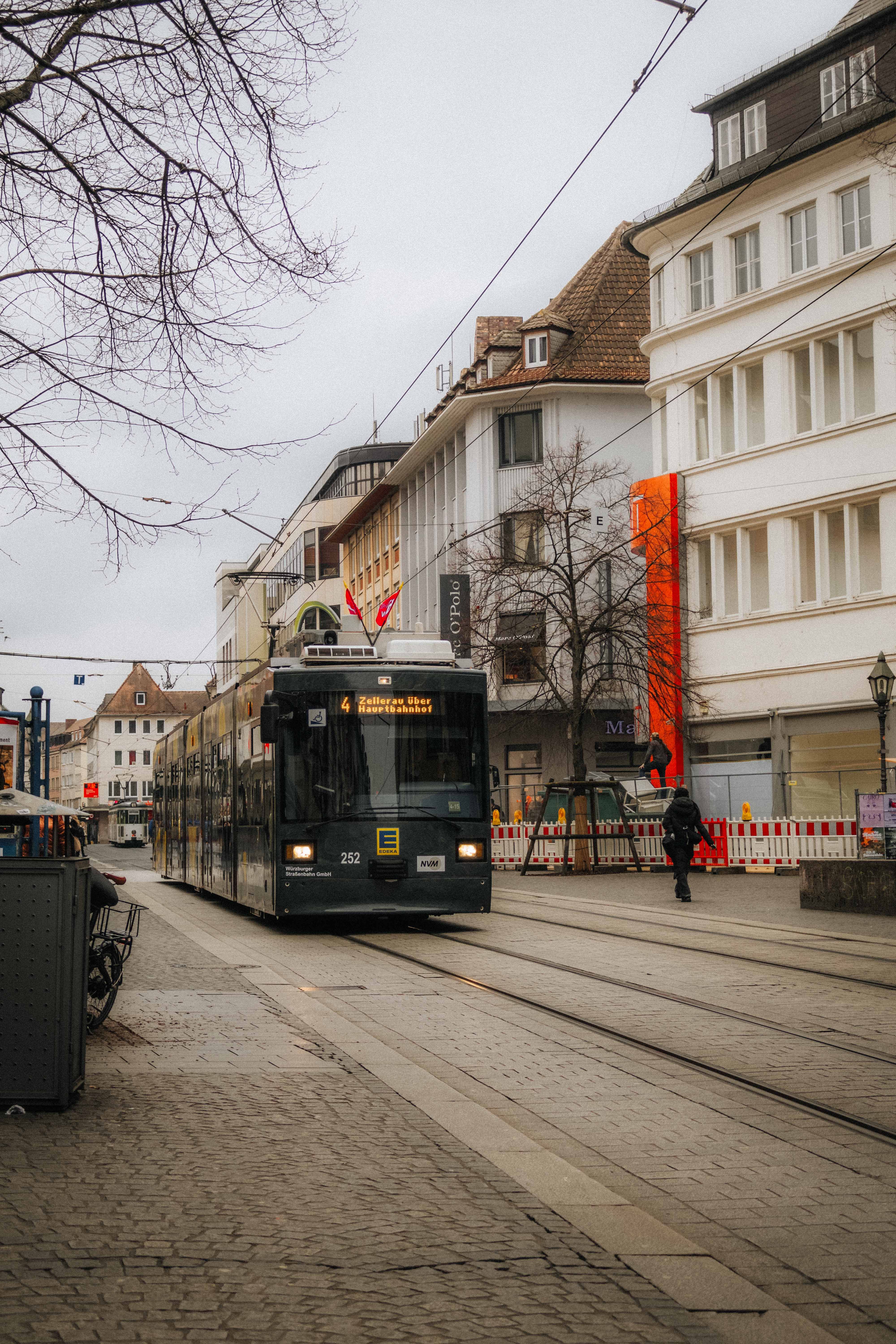Urban Tram in Historic European Cityscape · Free Stock Photo