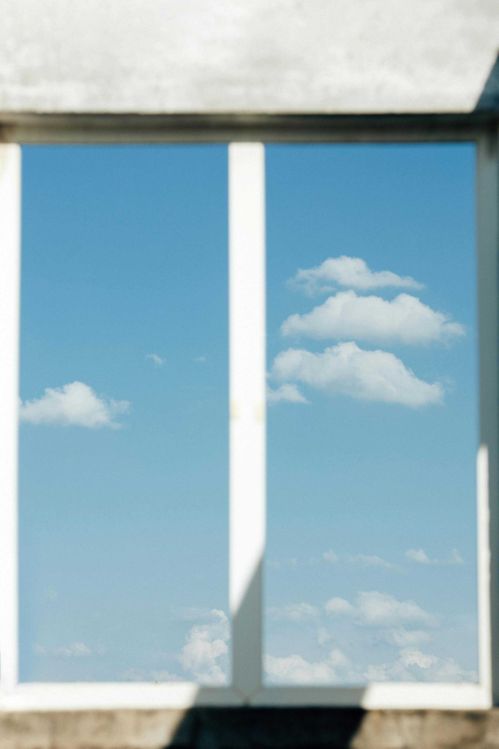 Clear Blue Sky Through a Window Frame · Free Stock Photo