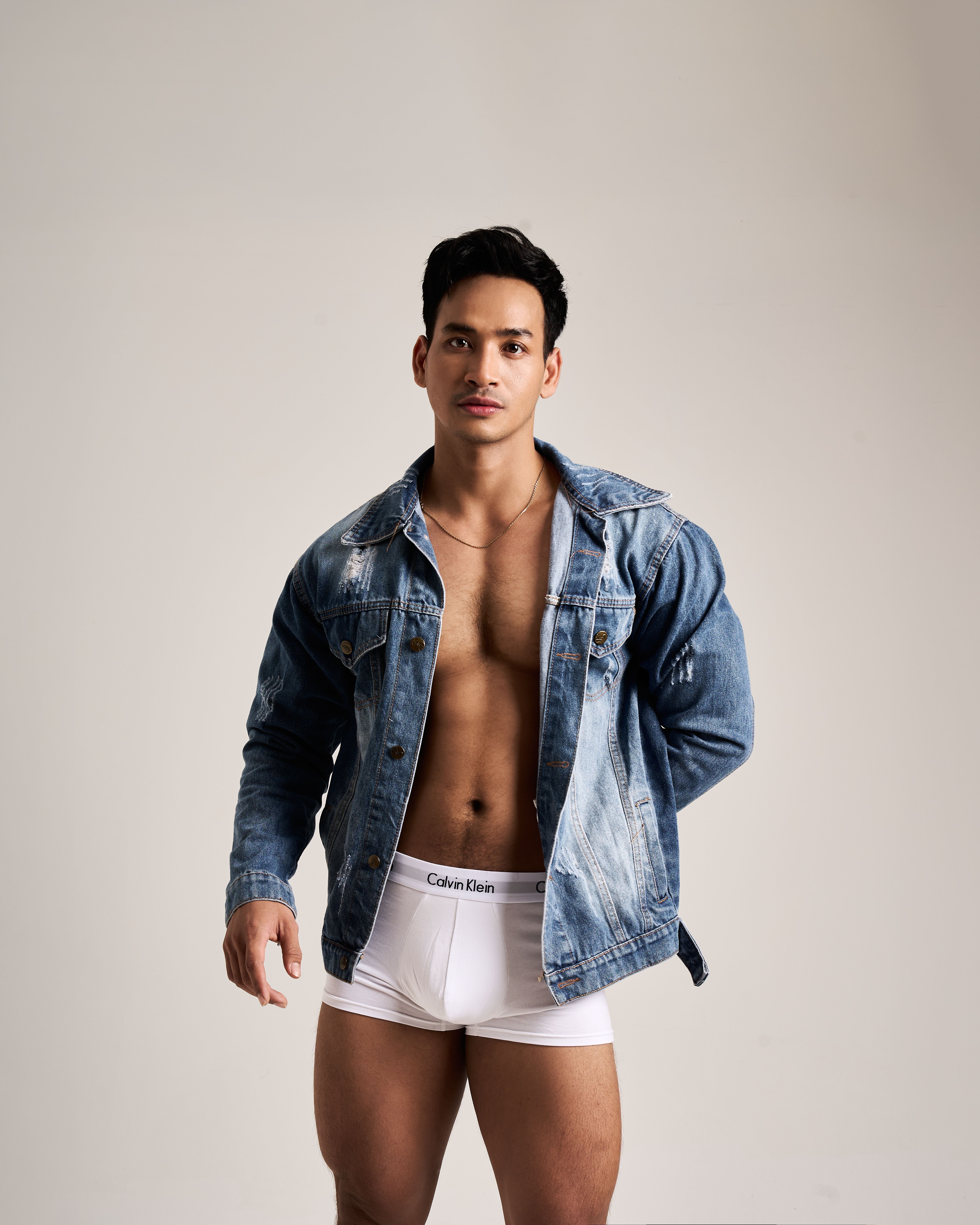 Stylish Portrait of Shirtless Male Model in Denim Jacket · Free Stock Photo