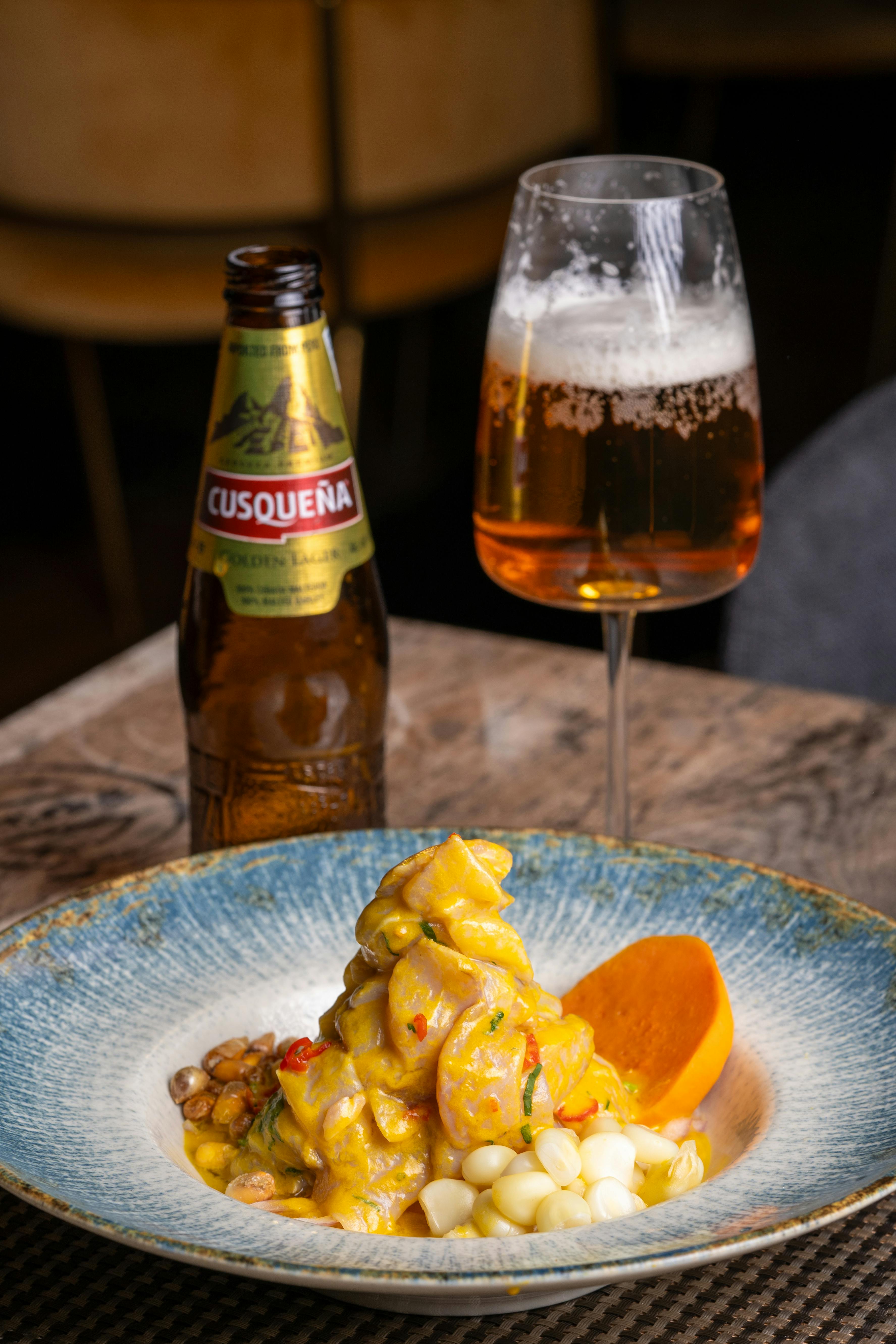 Peruvian Ceviche with Cusqueña Beer · Free Stock Photo