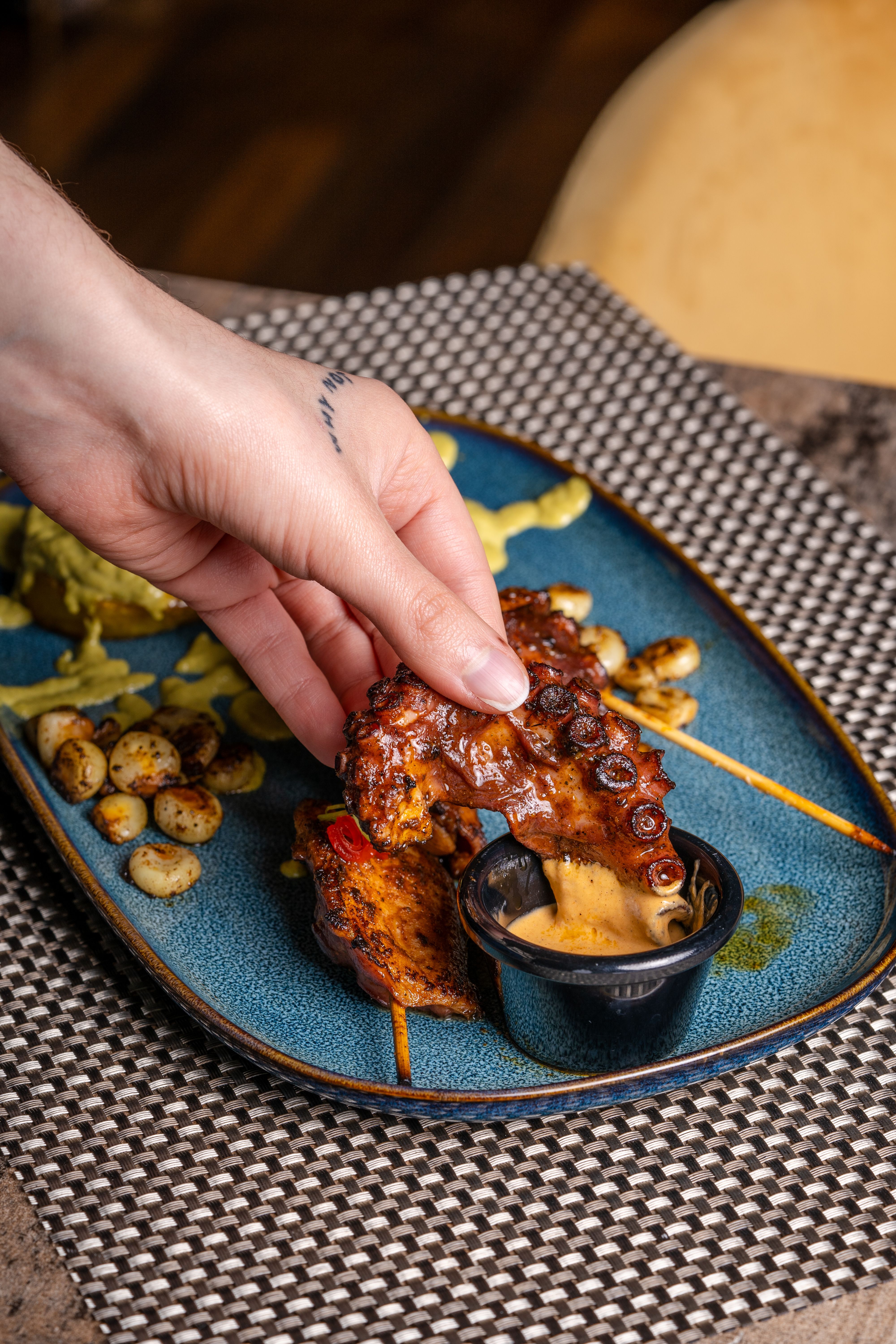 Gourmet Grilled Octopus with Dipping Sauce · Free Stock Photo