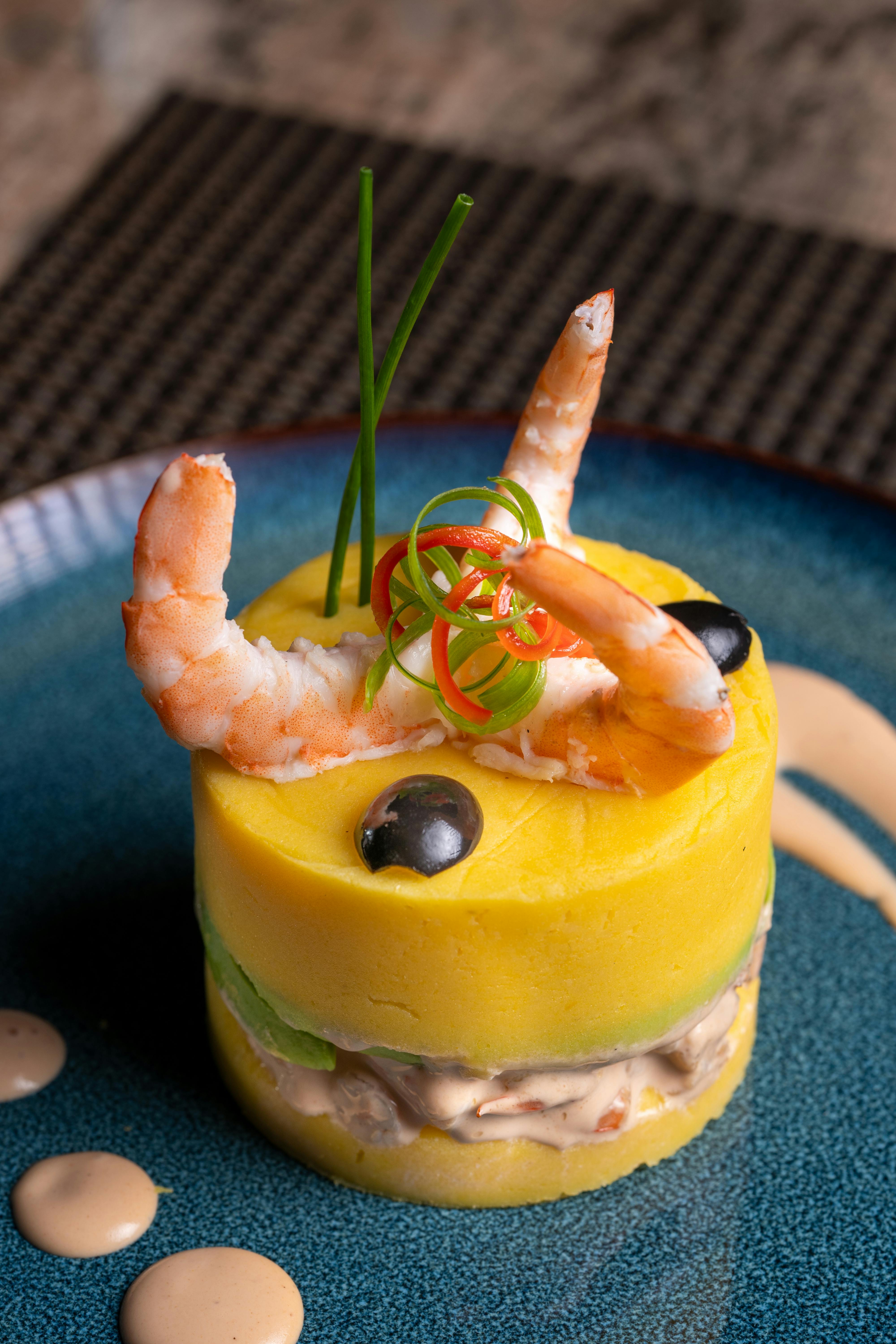 Gourmet Shrimp Causa on Blue Plate · Free Stock Photo