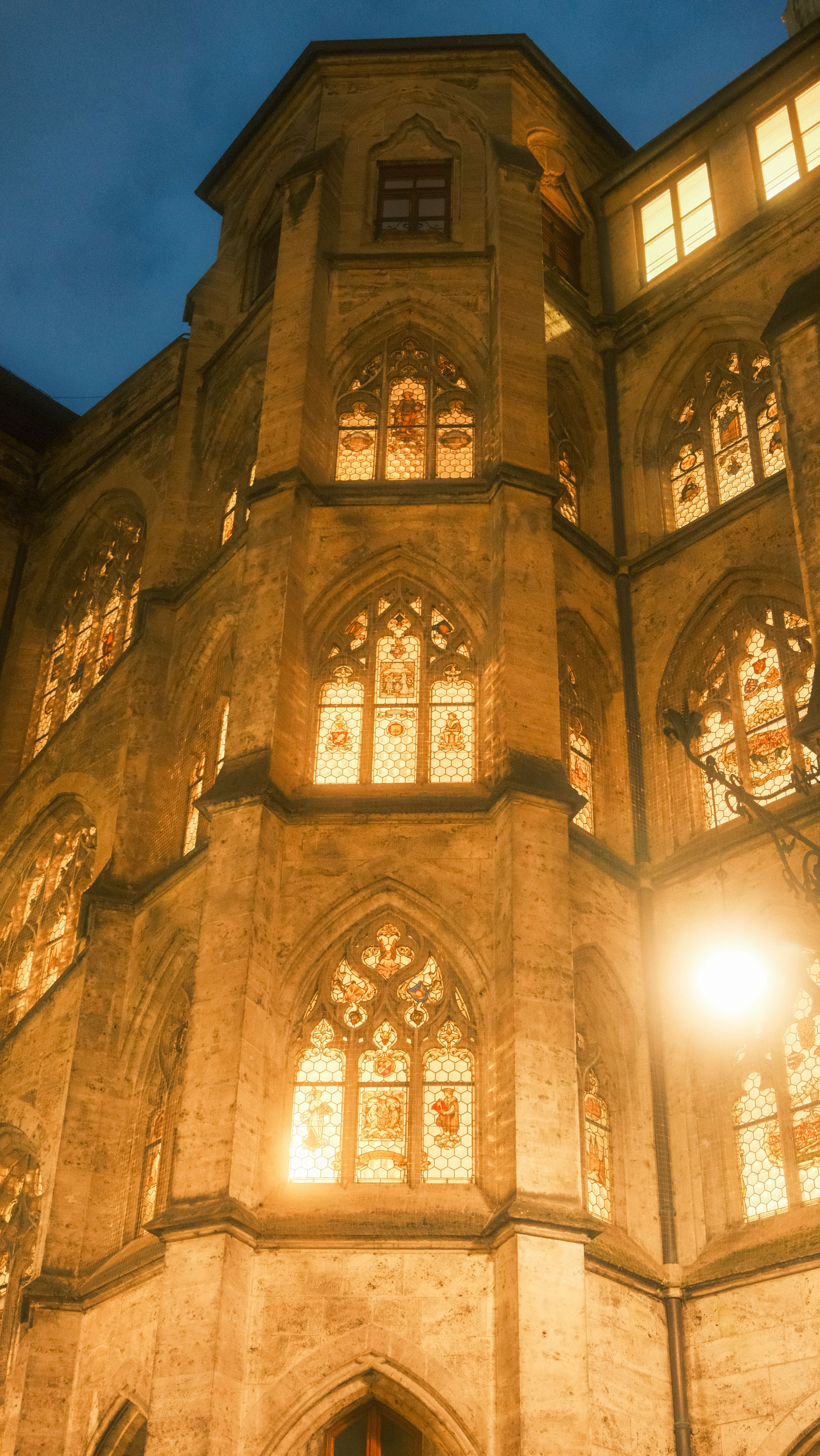 Gothic Architecture with Illuminated Stained Glass · Free Stock Photo