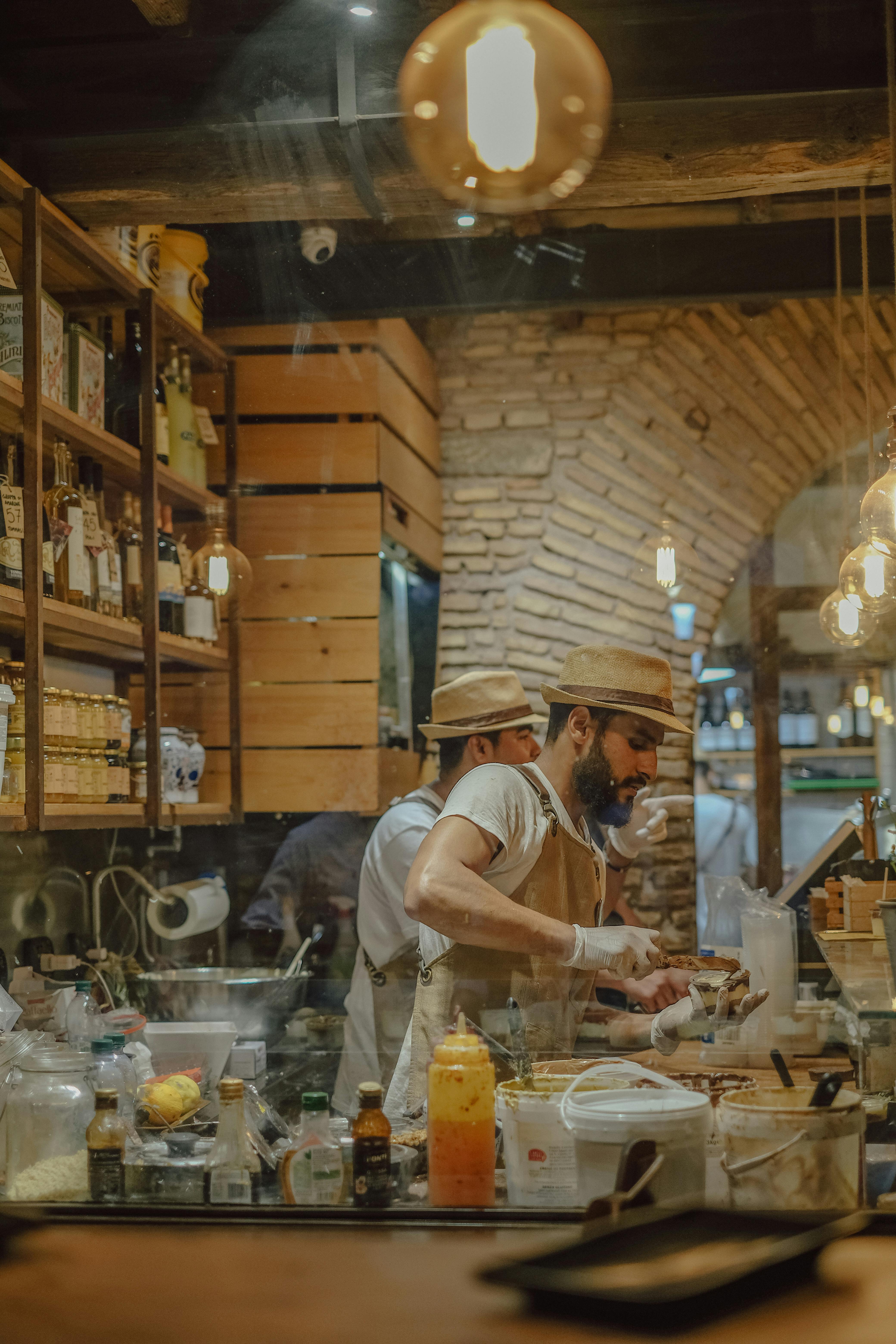 Rustic Kitchen Scene with Chefs at Work · Free Stock Photo