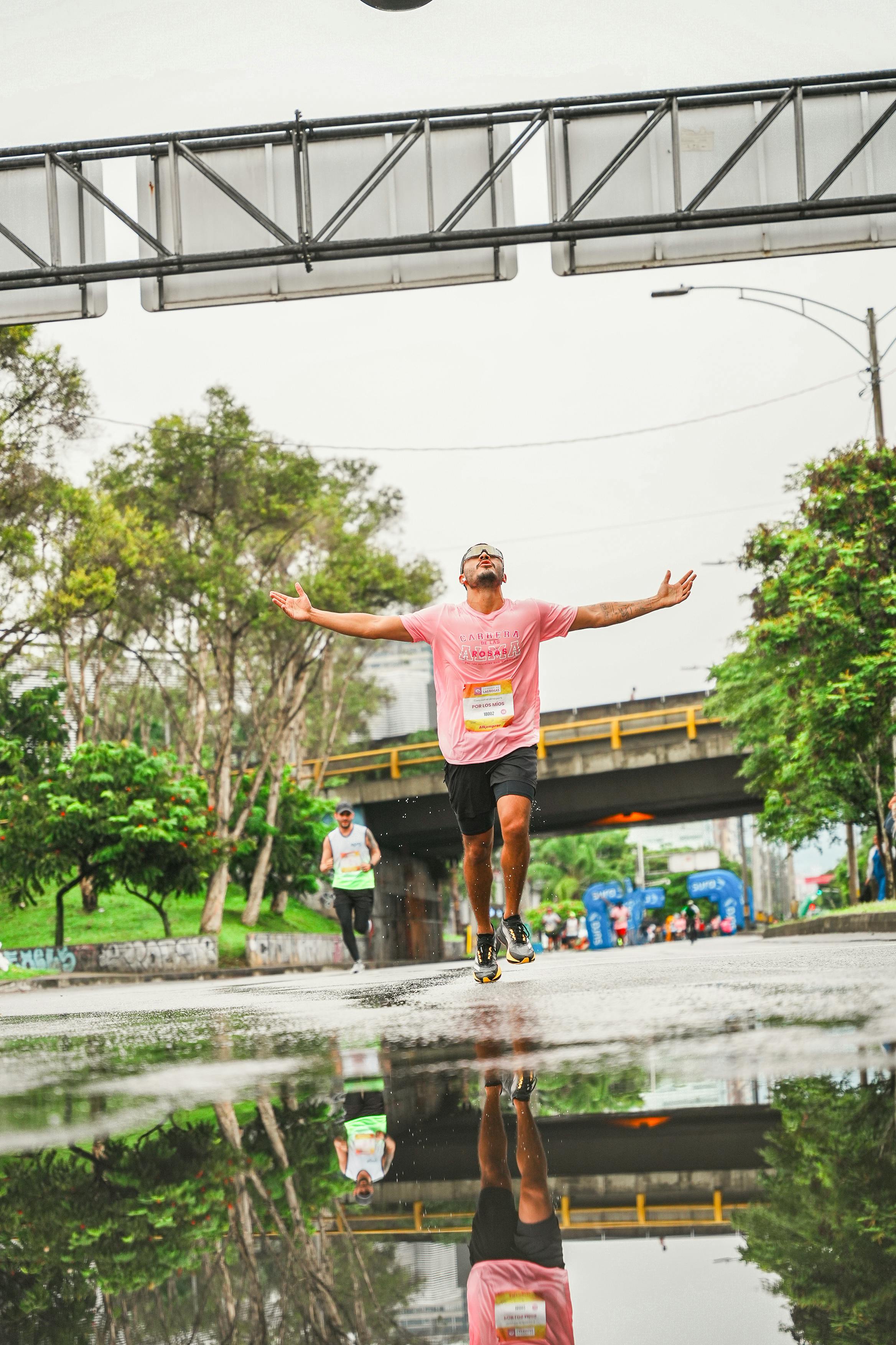 Joyful Marathon Runner Crossing Finish Line · Free Stock Photo