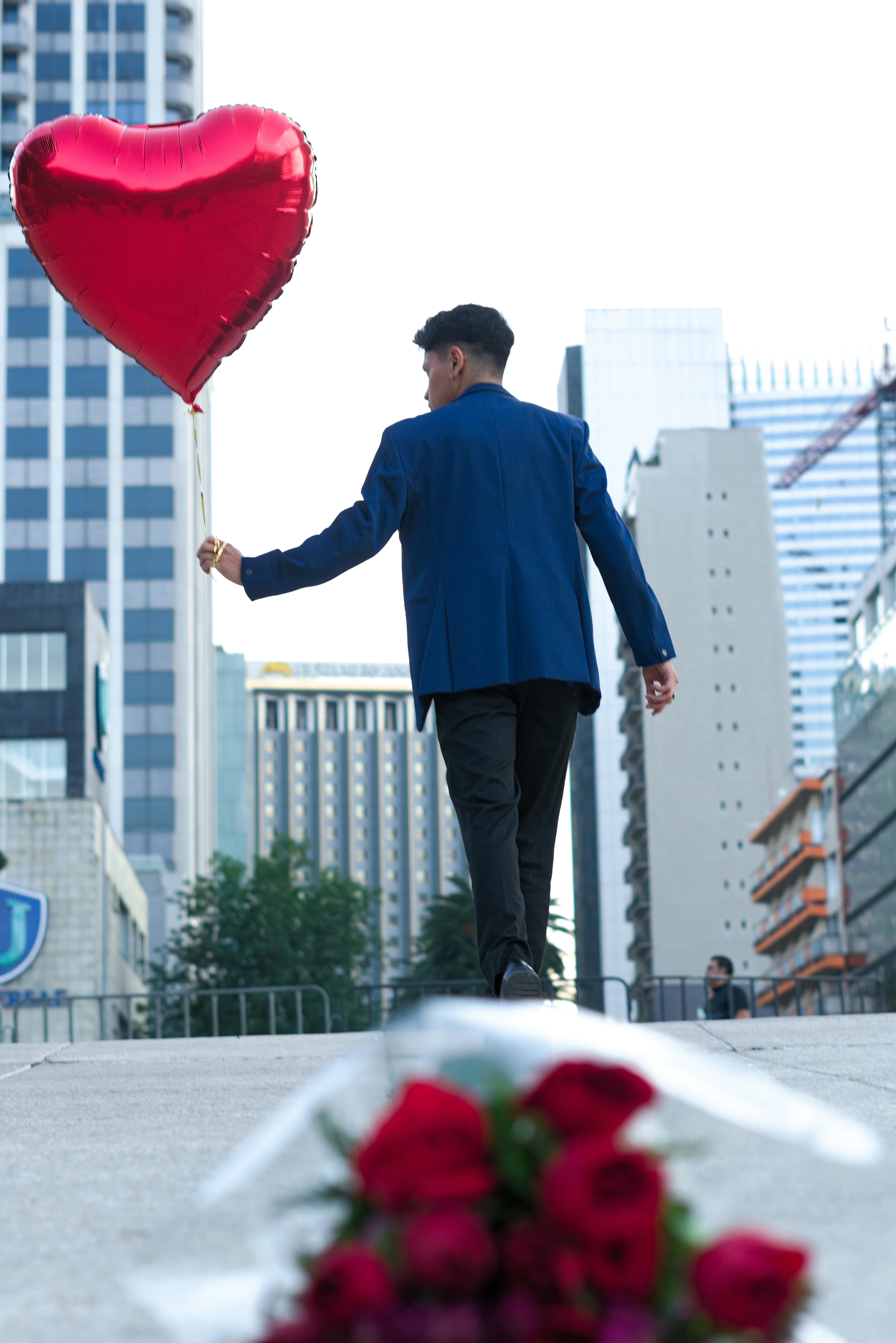 Romantic Cityscape with Heart Balloon & Flowers · Free Stock Photo