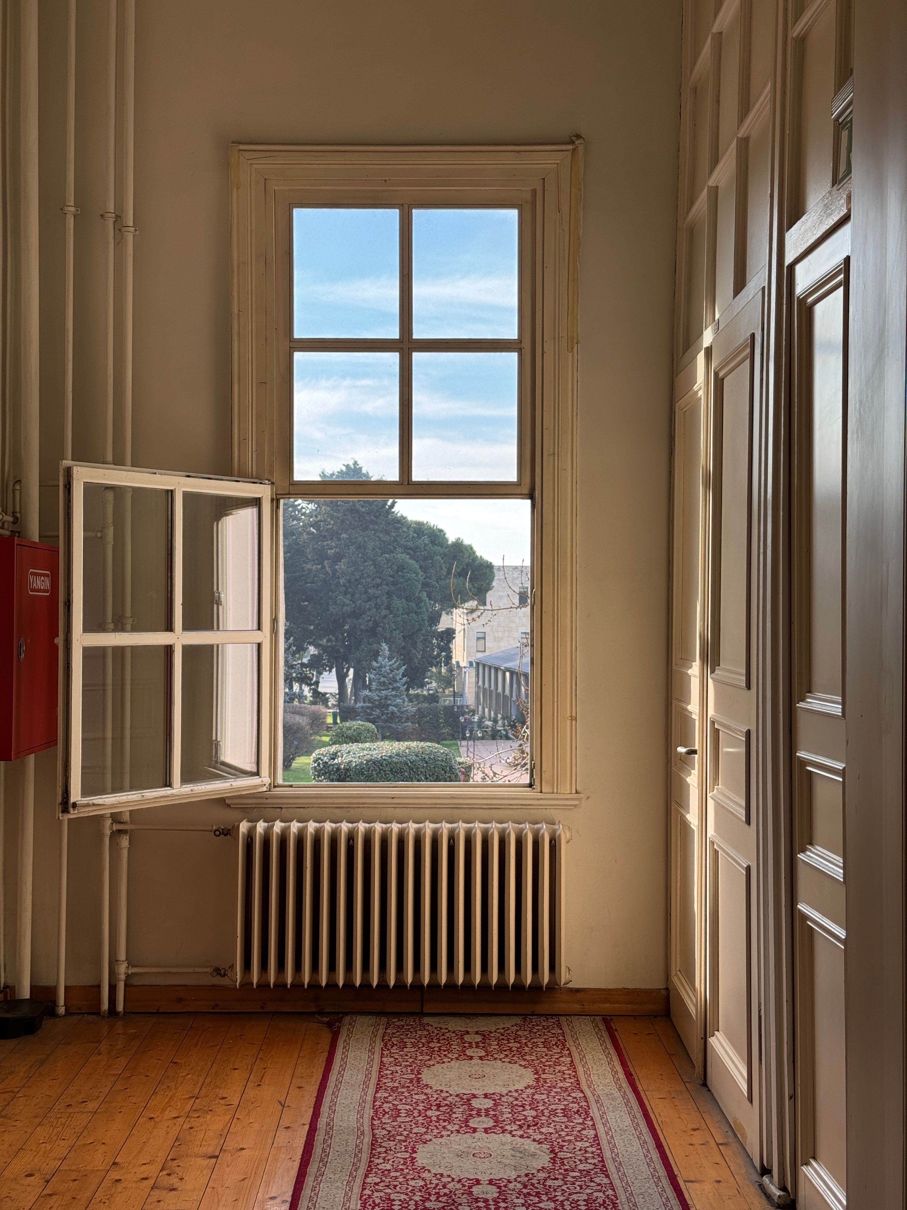 Open Window Overlooking Scenic Urban Landscape · Free Stock Photo