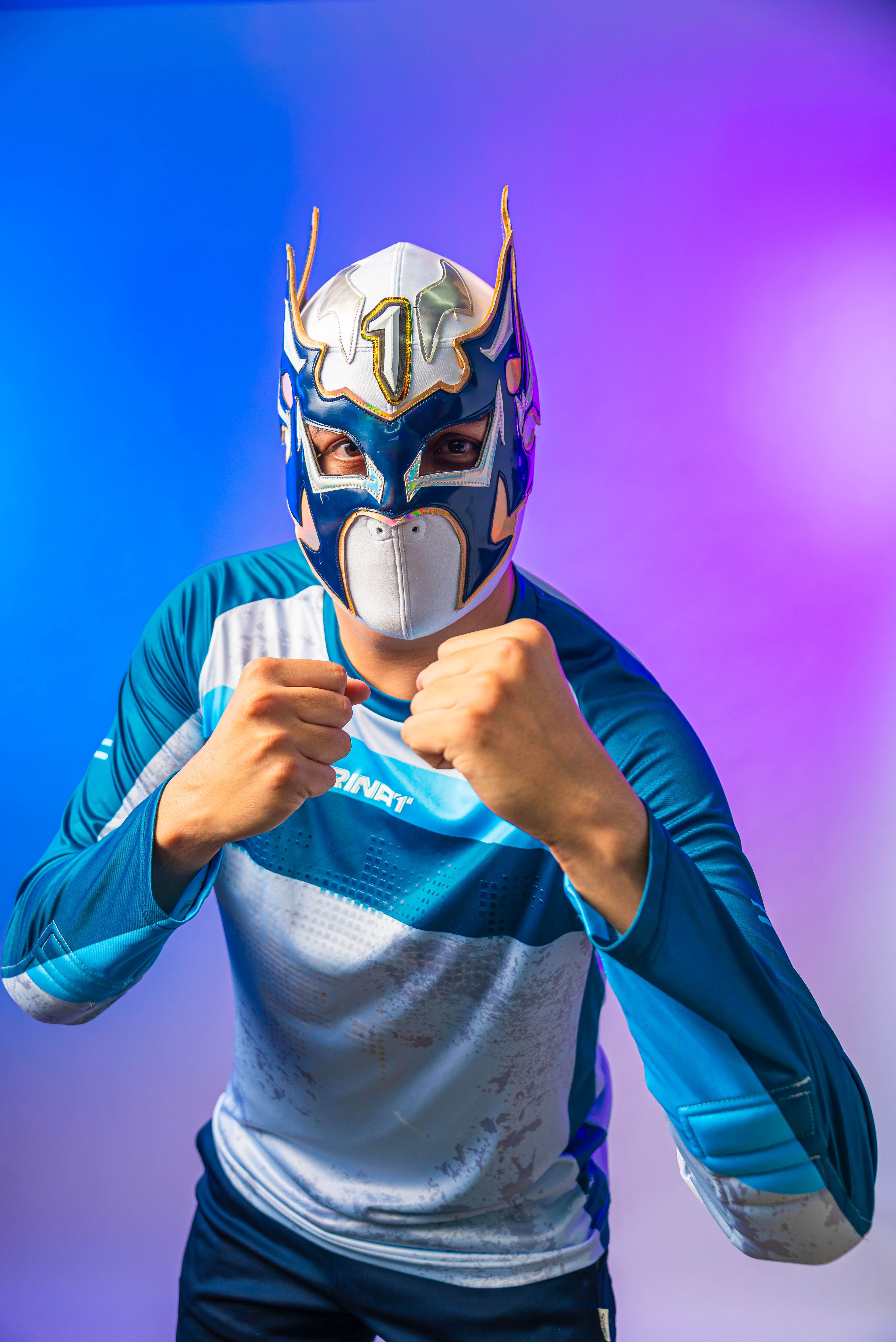 Colorful Lucha Libre Wrestler in Mask Pose · Free Stock Photo