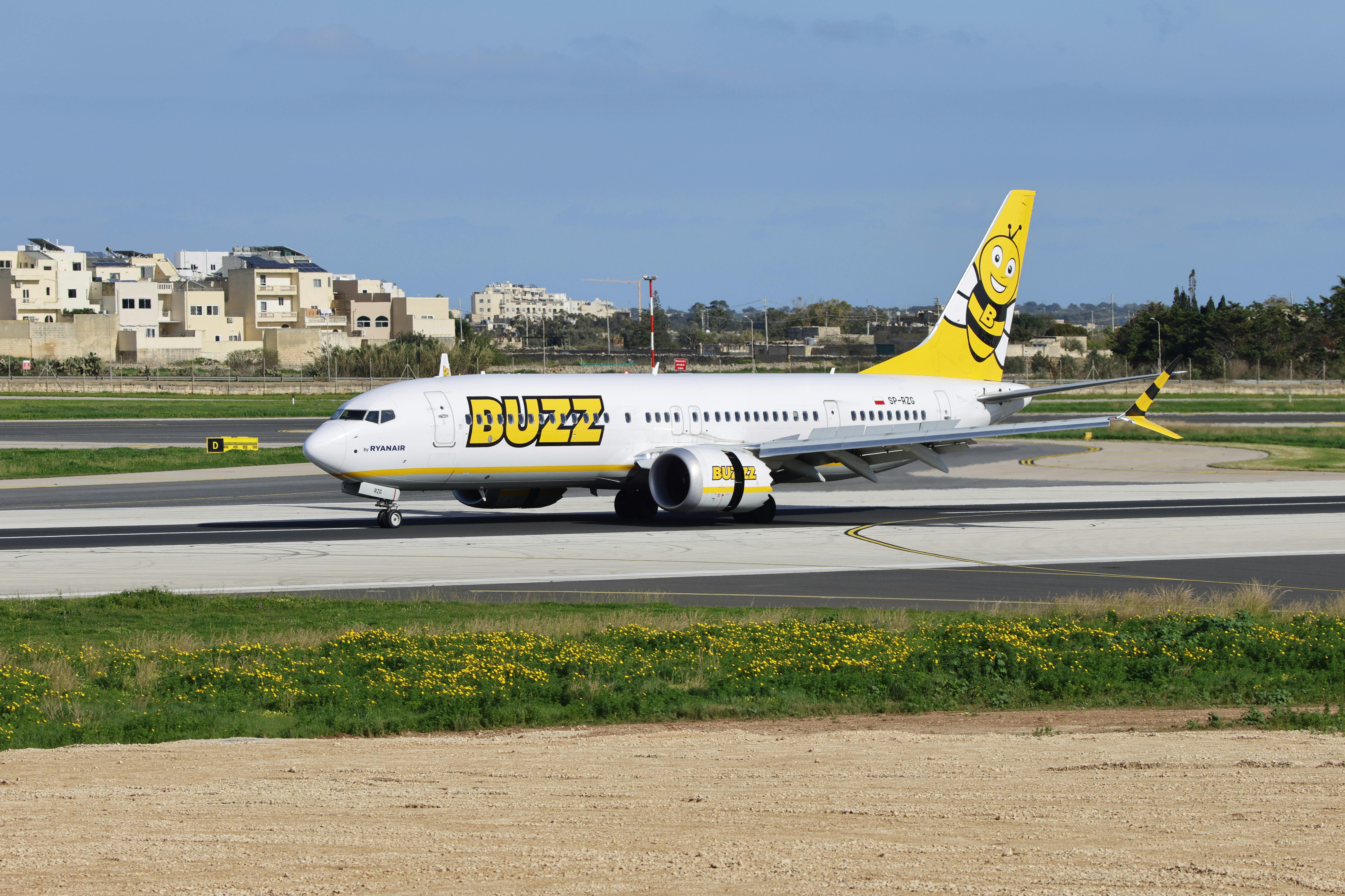 Buzz Airline Ryanair Plane on the Runway · Free Stock Photo