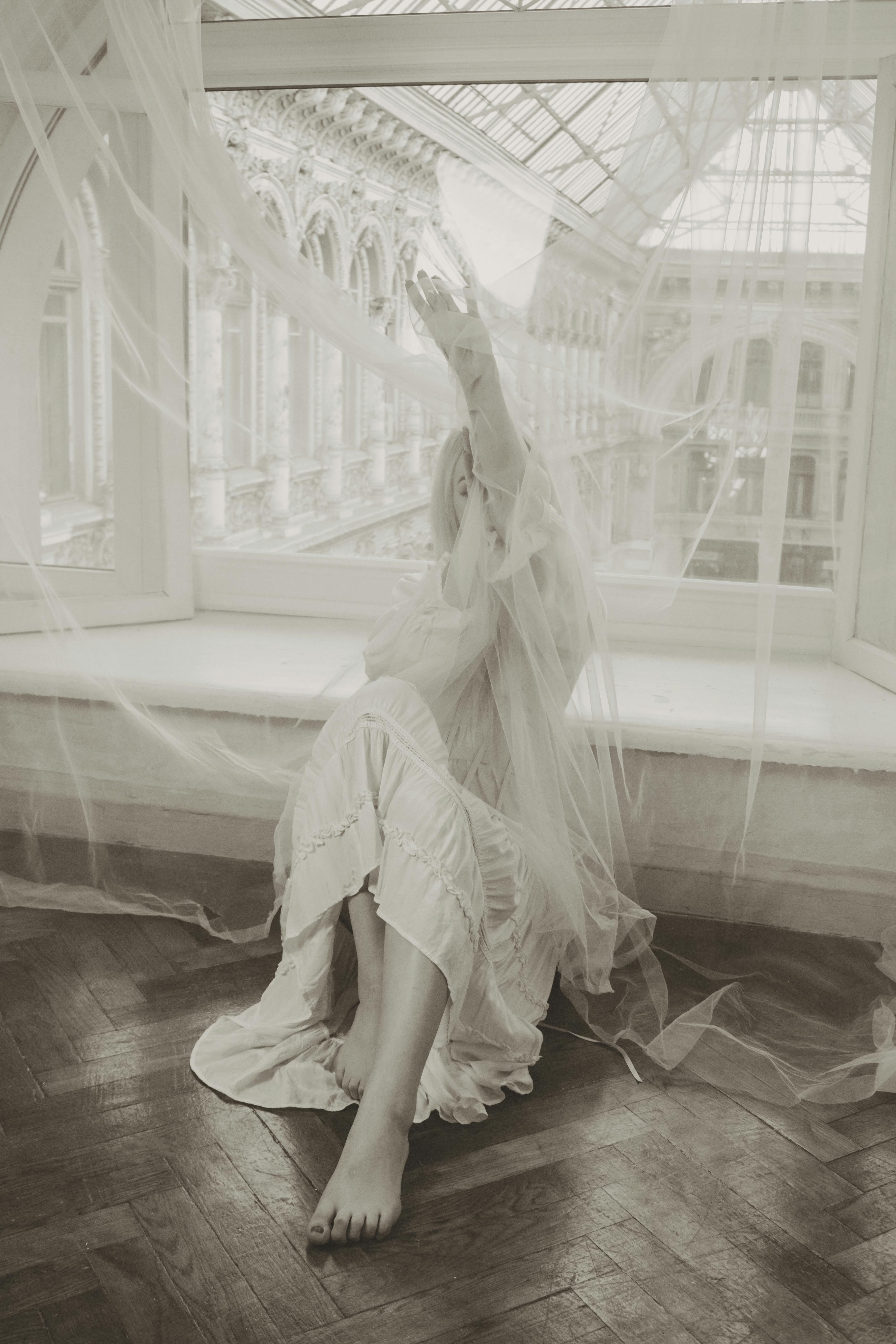 Elegant Woman in Vintage Sepia Tone Setting · Free Stock Photo