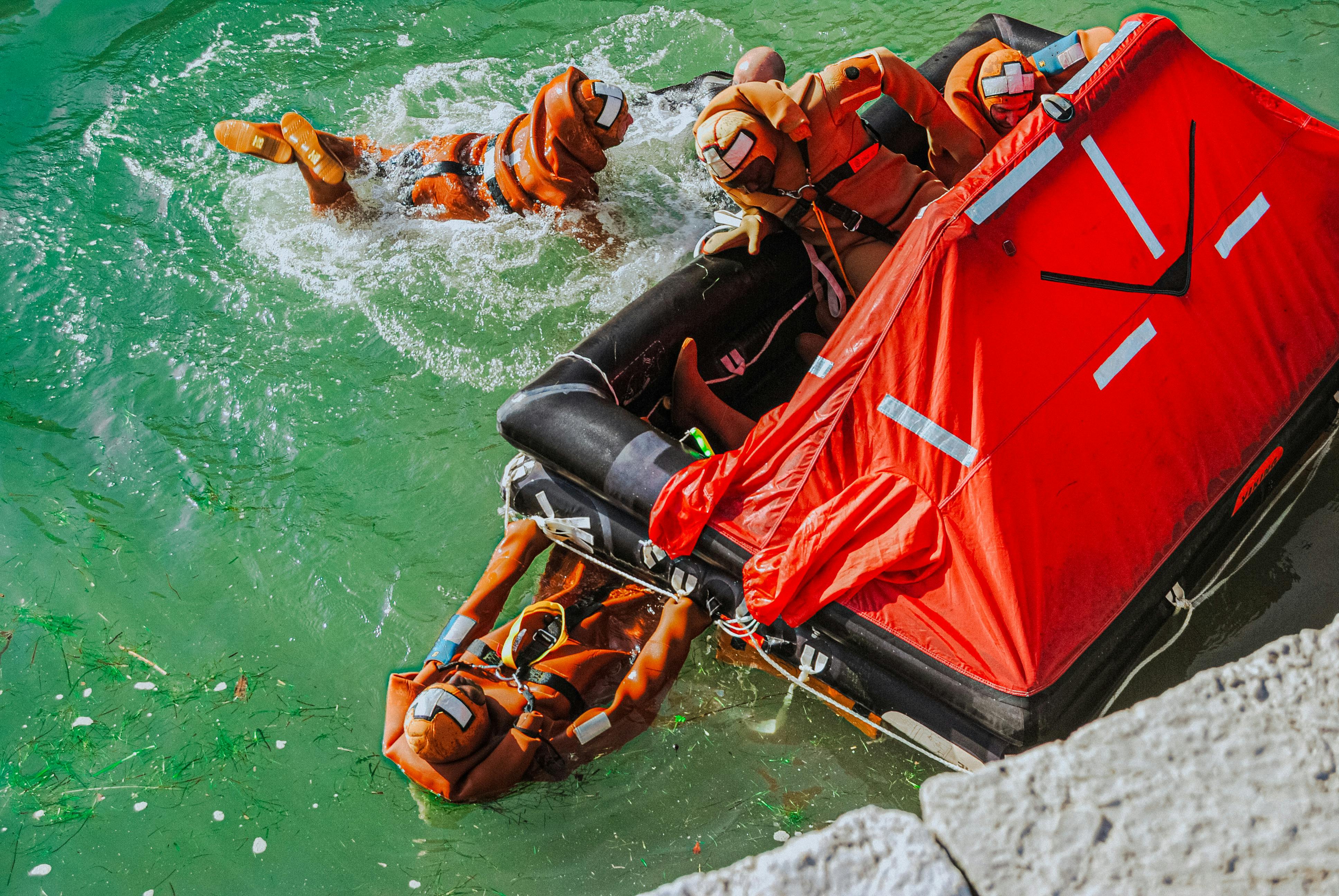 Rescue Team Training in Water with Life Raft · Free Stock Photo