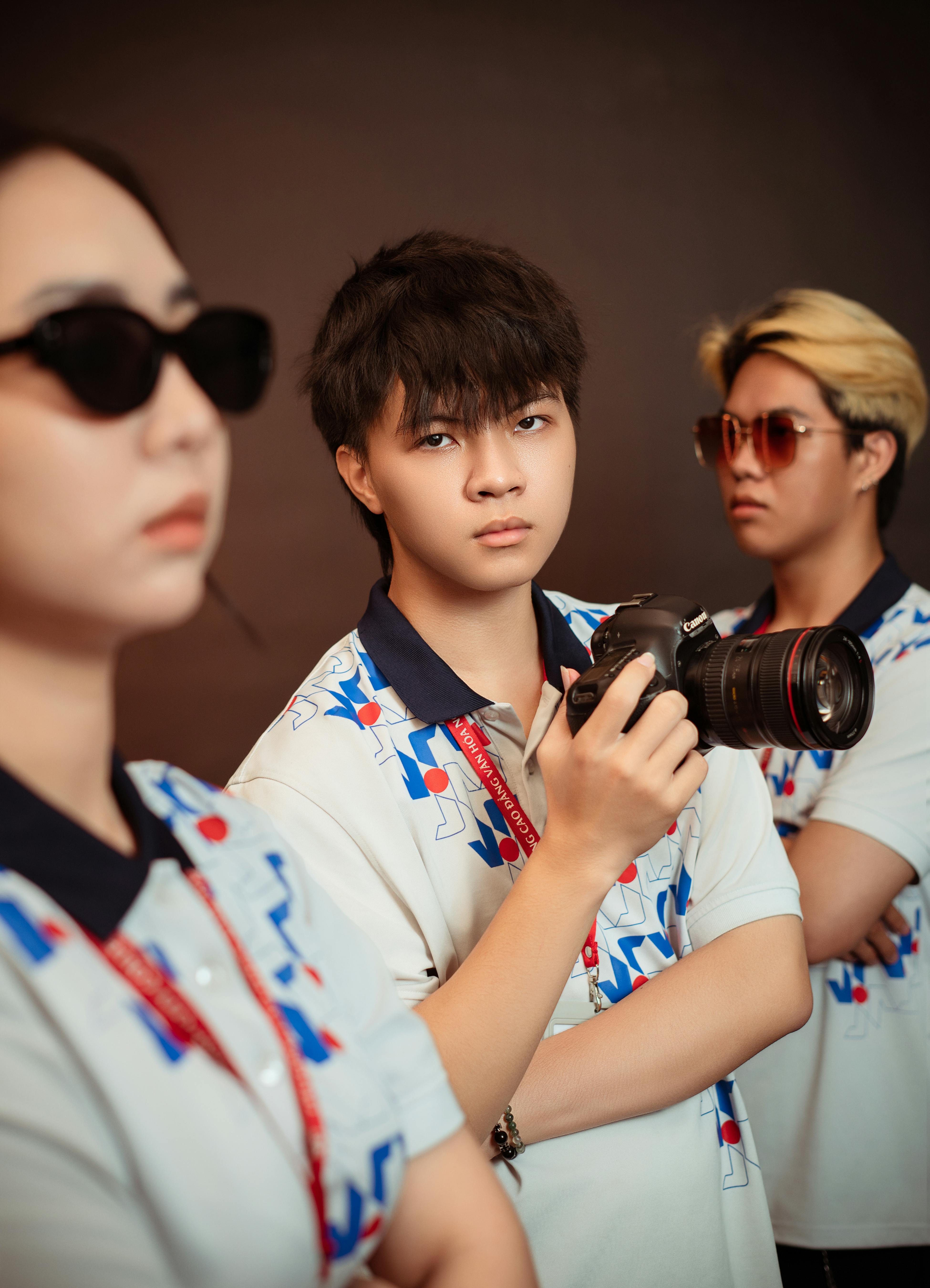 Dynamic Student Photographers in Uniform · Free Stock Photo